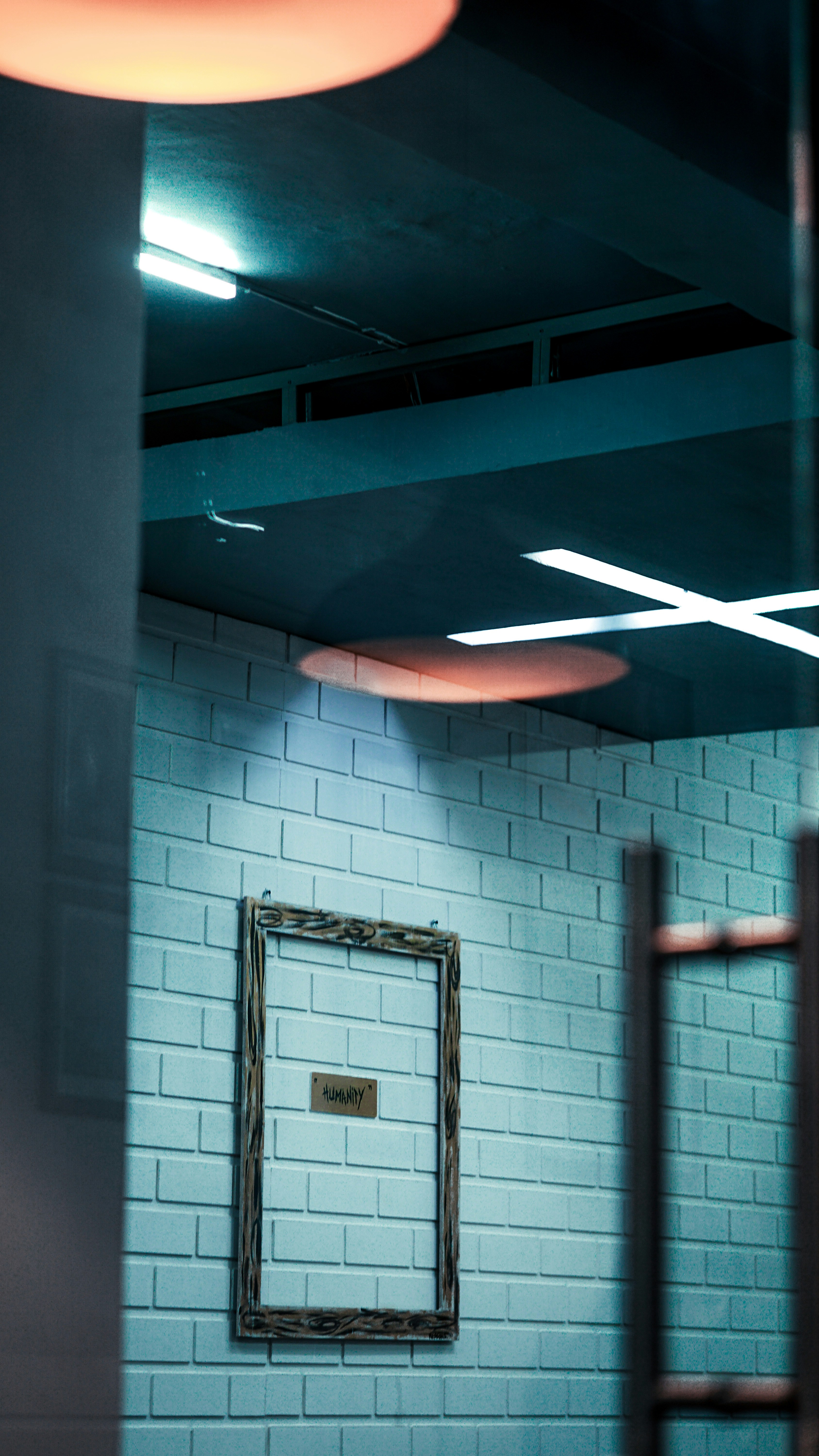 A picture frame hanging on a brick wall photo – Free India Image on ...