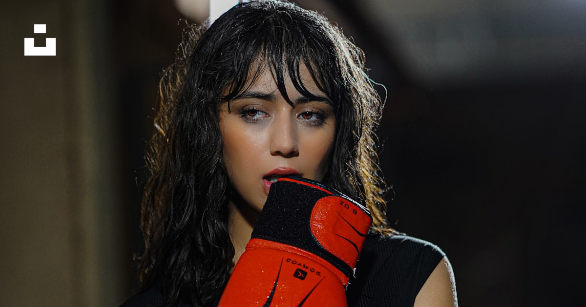 A Woman Wearing Red Boxing Gloves Posing For A Picture Photo Free