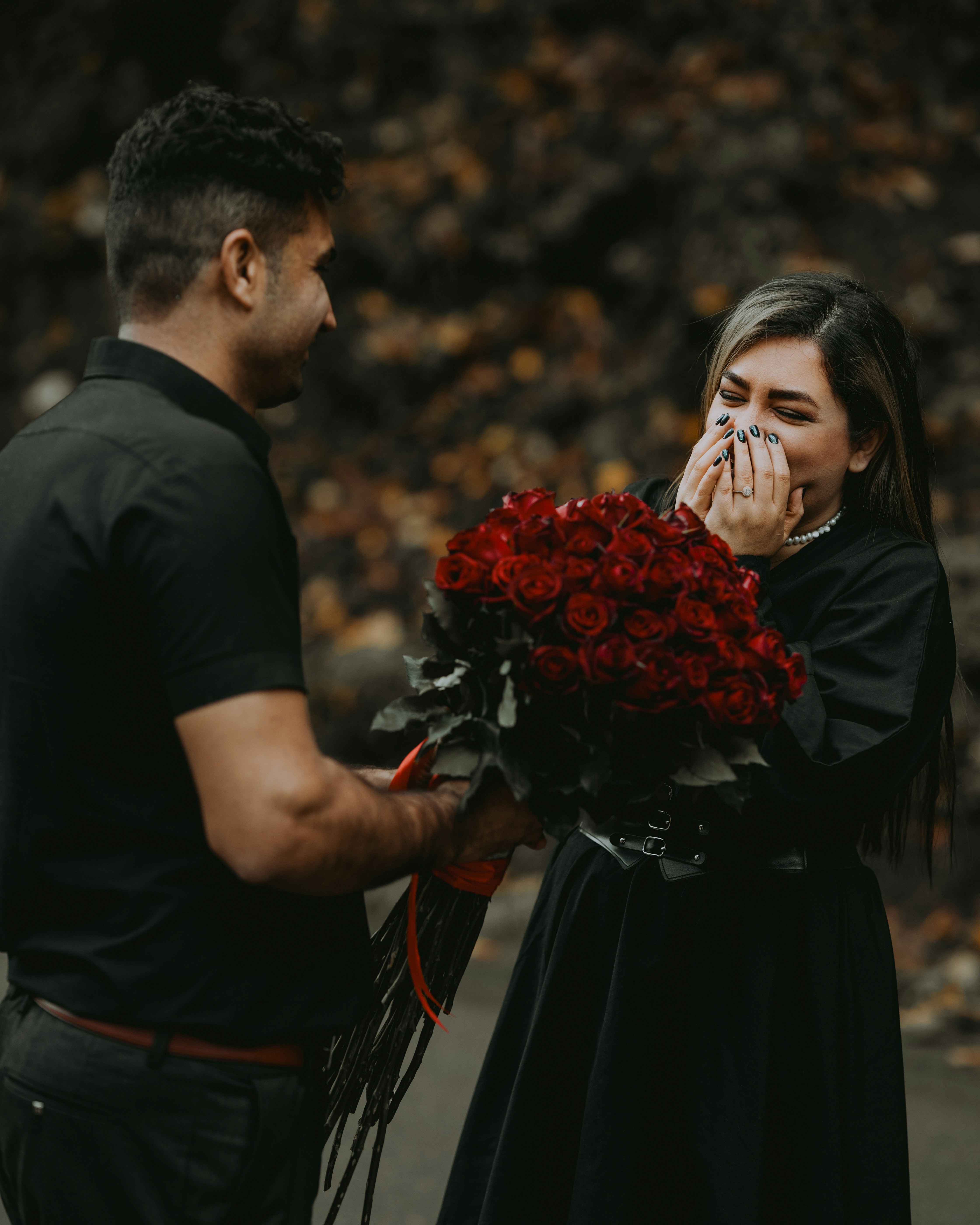 Crimson bouquet moment: laughter in autumn light