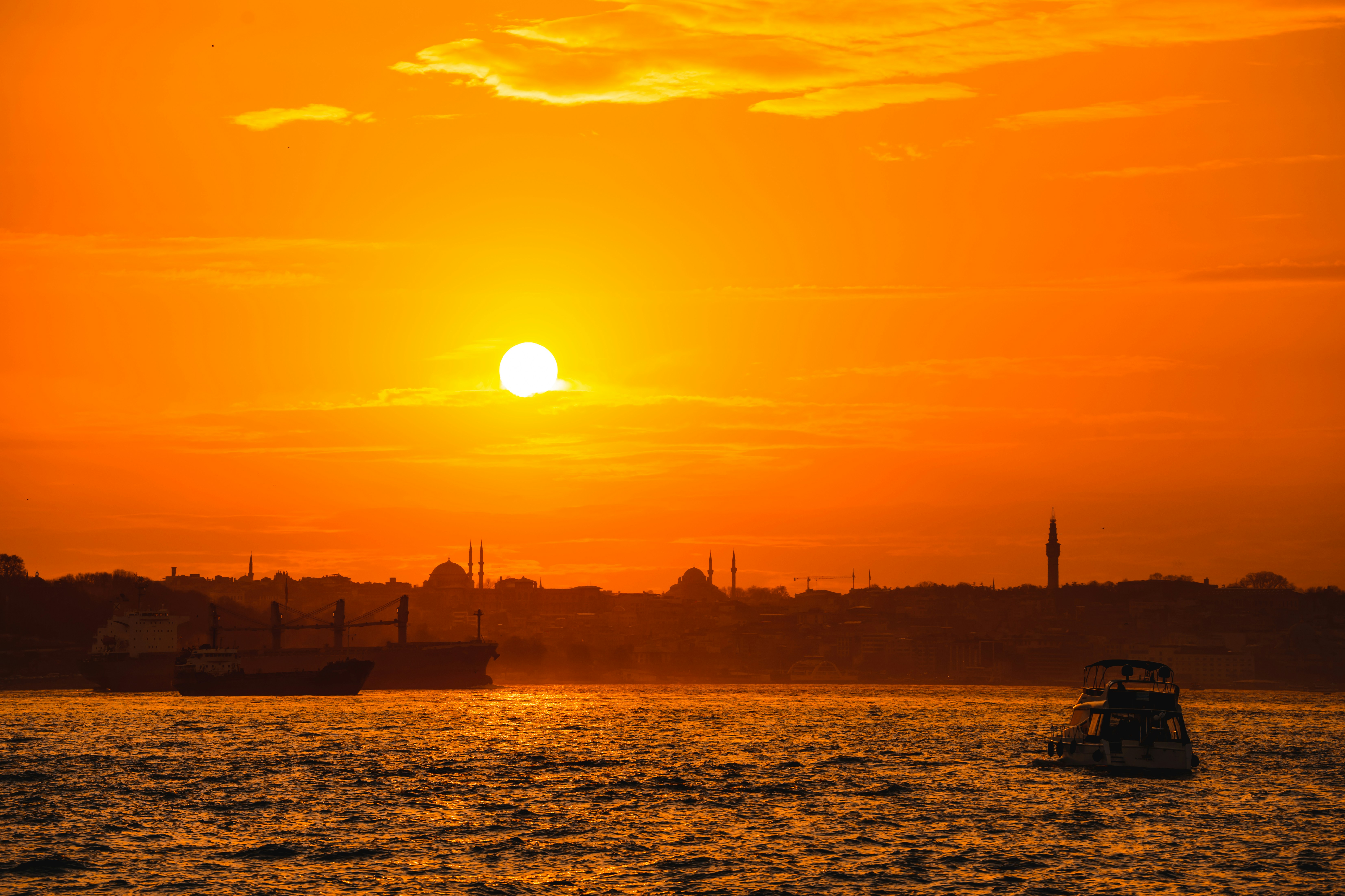 The sun is setting over a body of water photo – Free Travel Image on ...