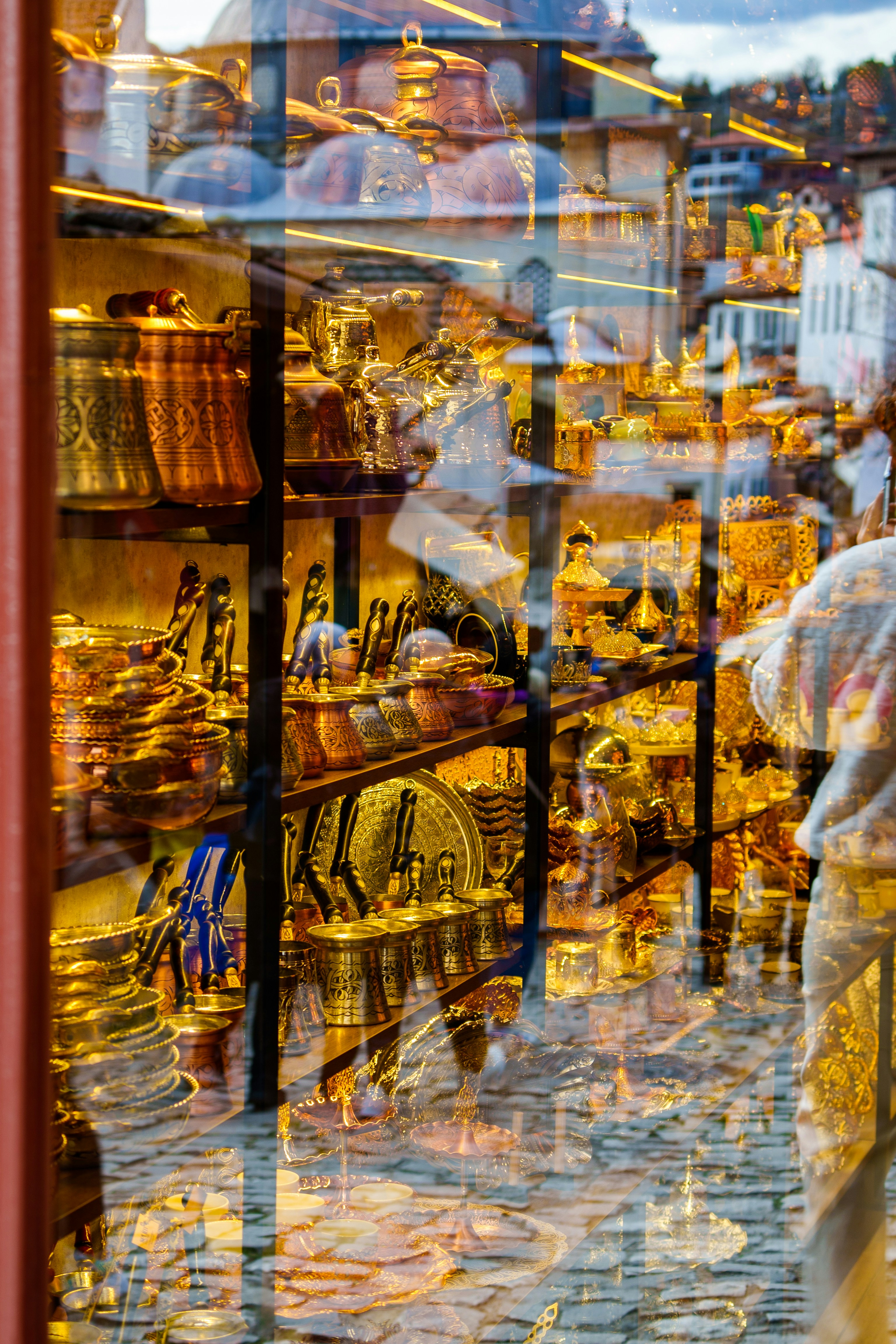A store window with a reflection of a person in it photo – Free Türkiye ...