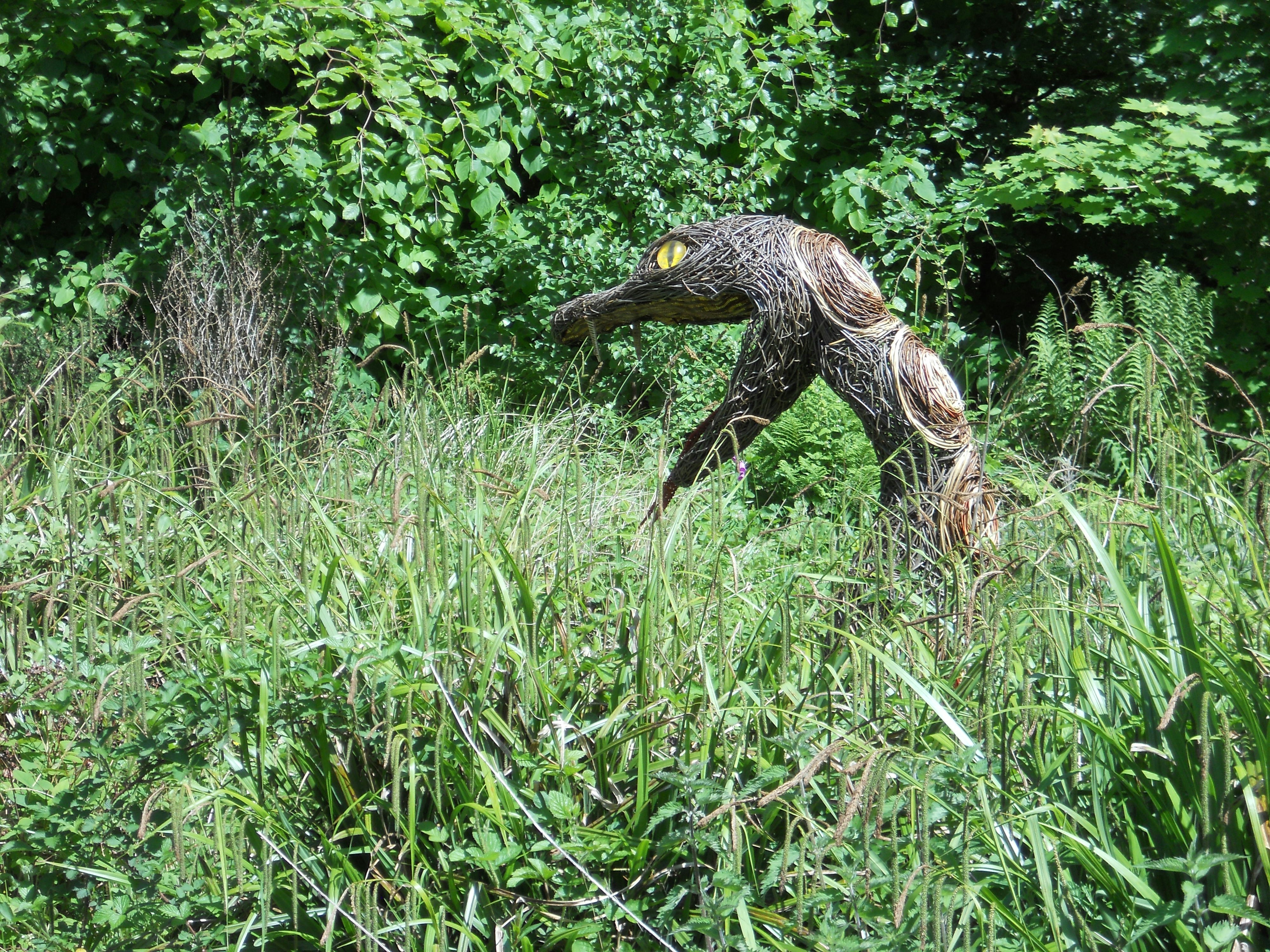 Heron-Scaled Stand: A Heron Emerges from the Marsh Grasses