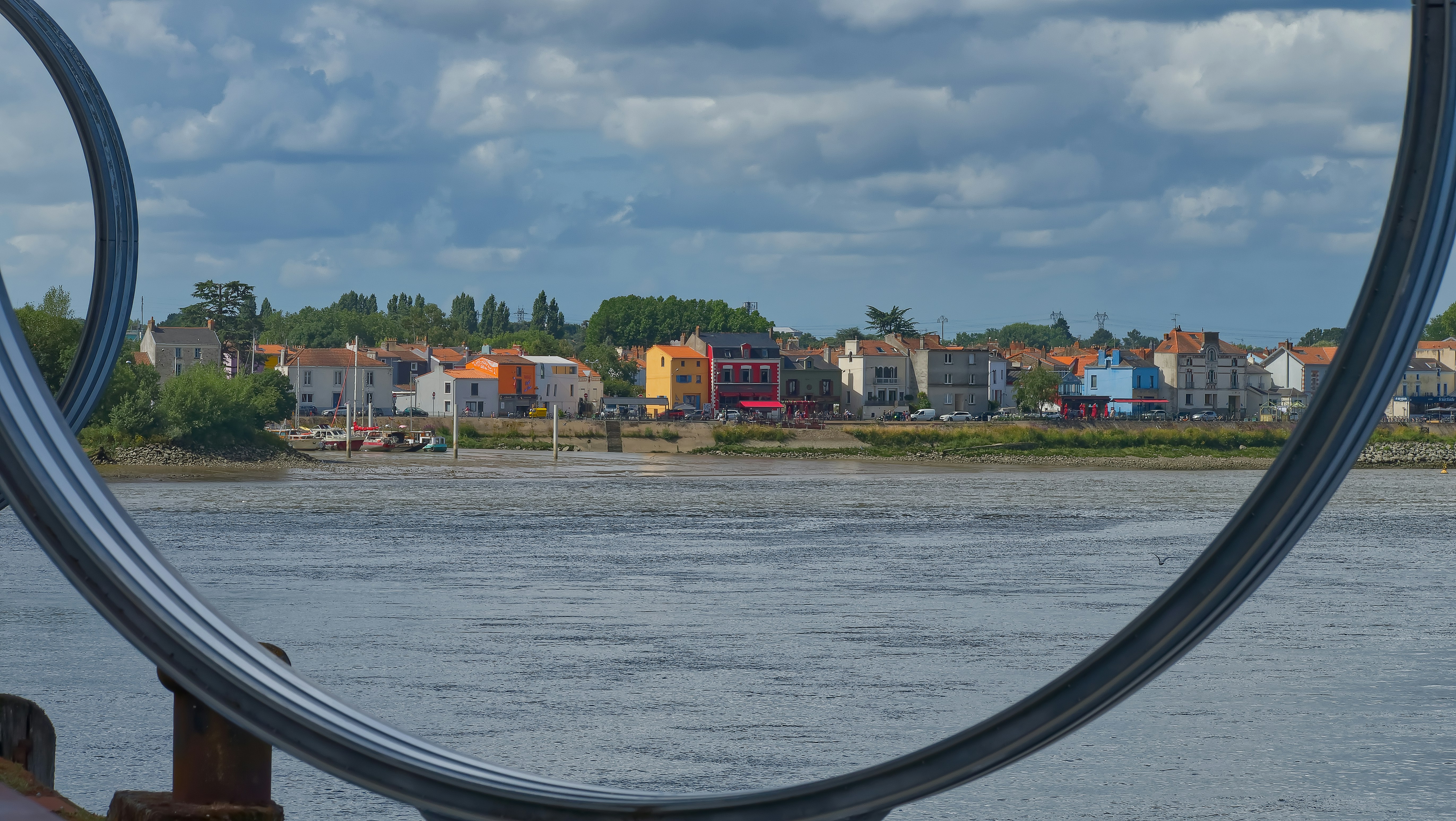Colorful Riverside Row Framed by a Circular Harbor Ring