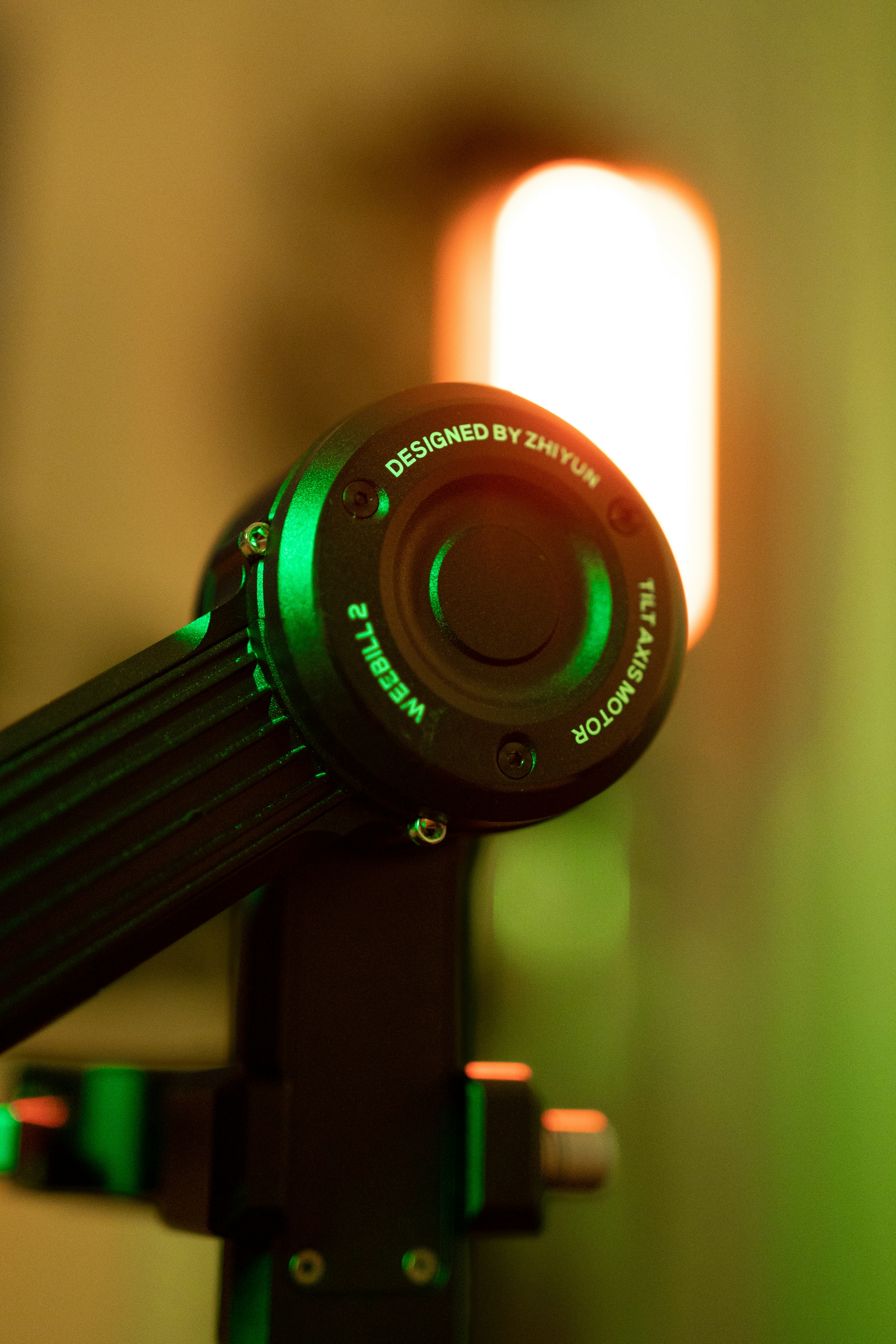 Emerald Ring on a Gimbal: Neon-Illuminated Close-Up of a Zhiyun Joint