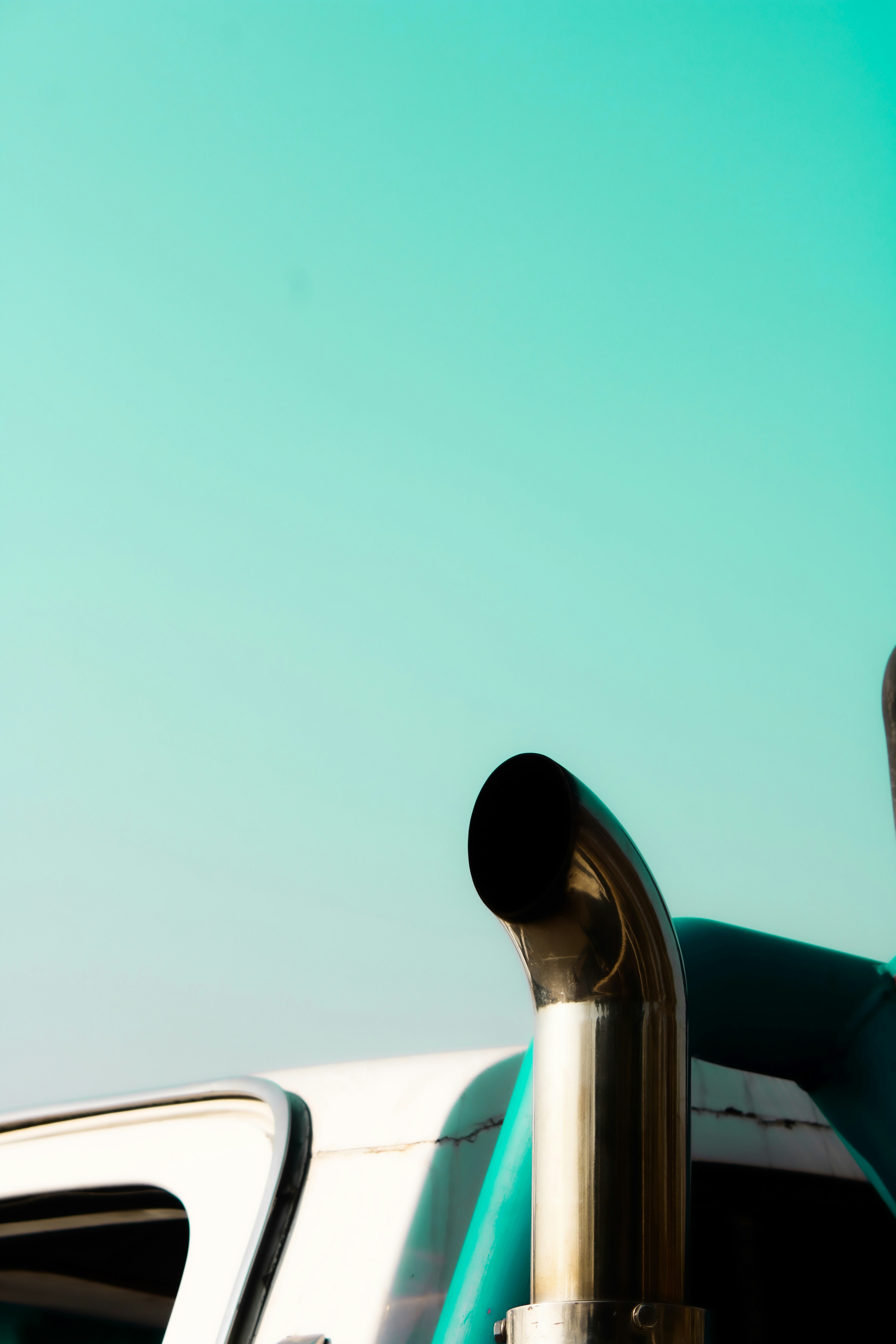 a close up of a car's exhaust pipe