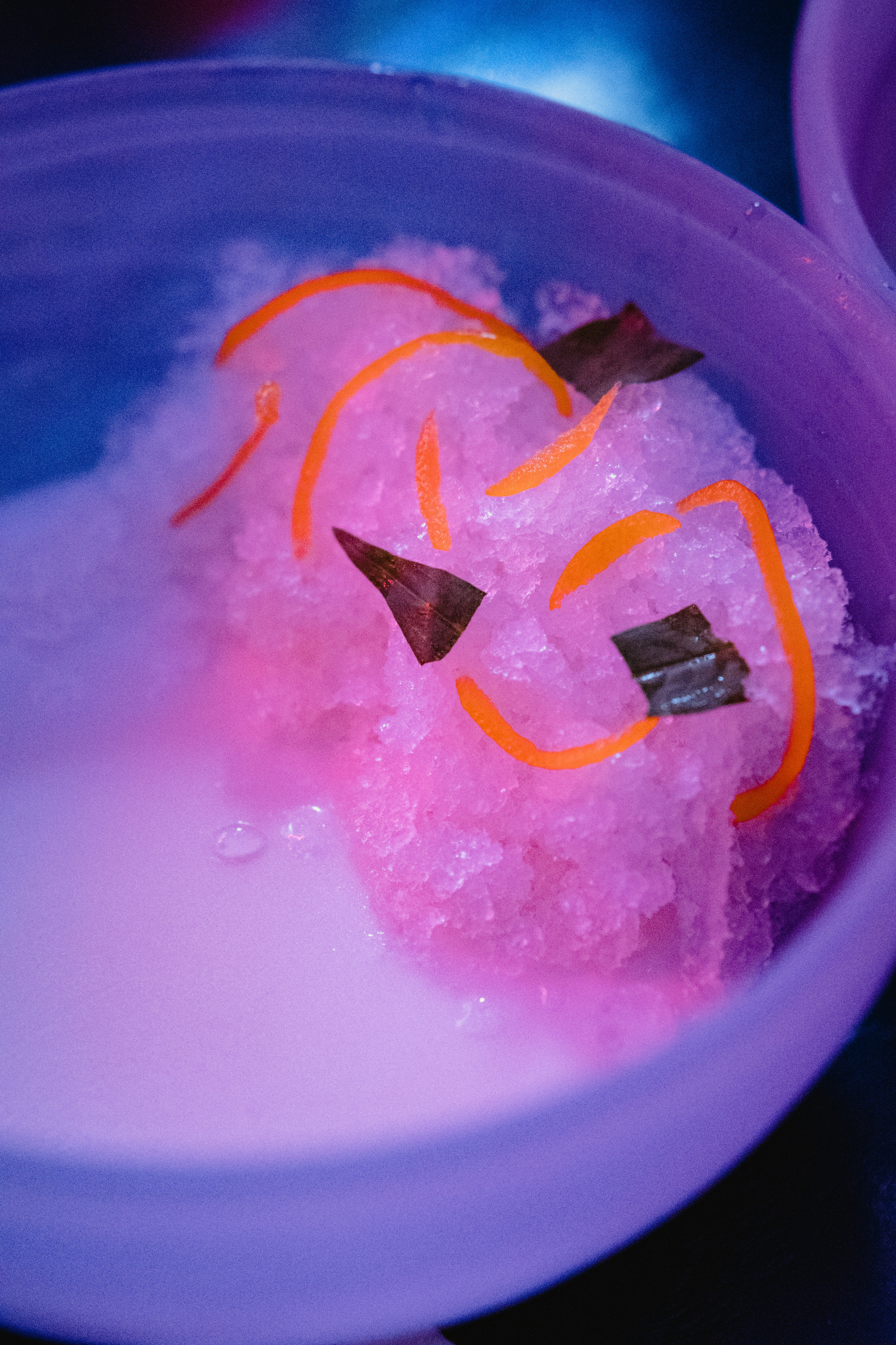 a purple bowl filled with a pink substance