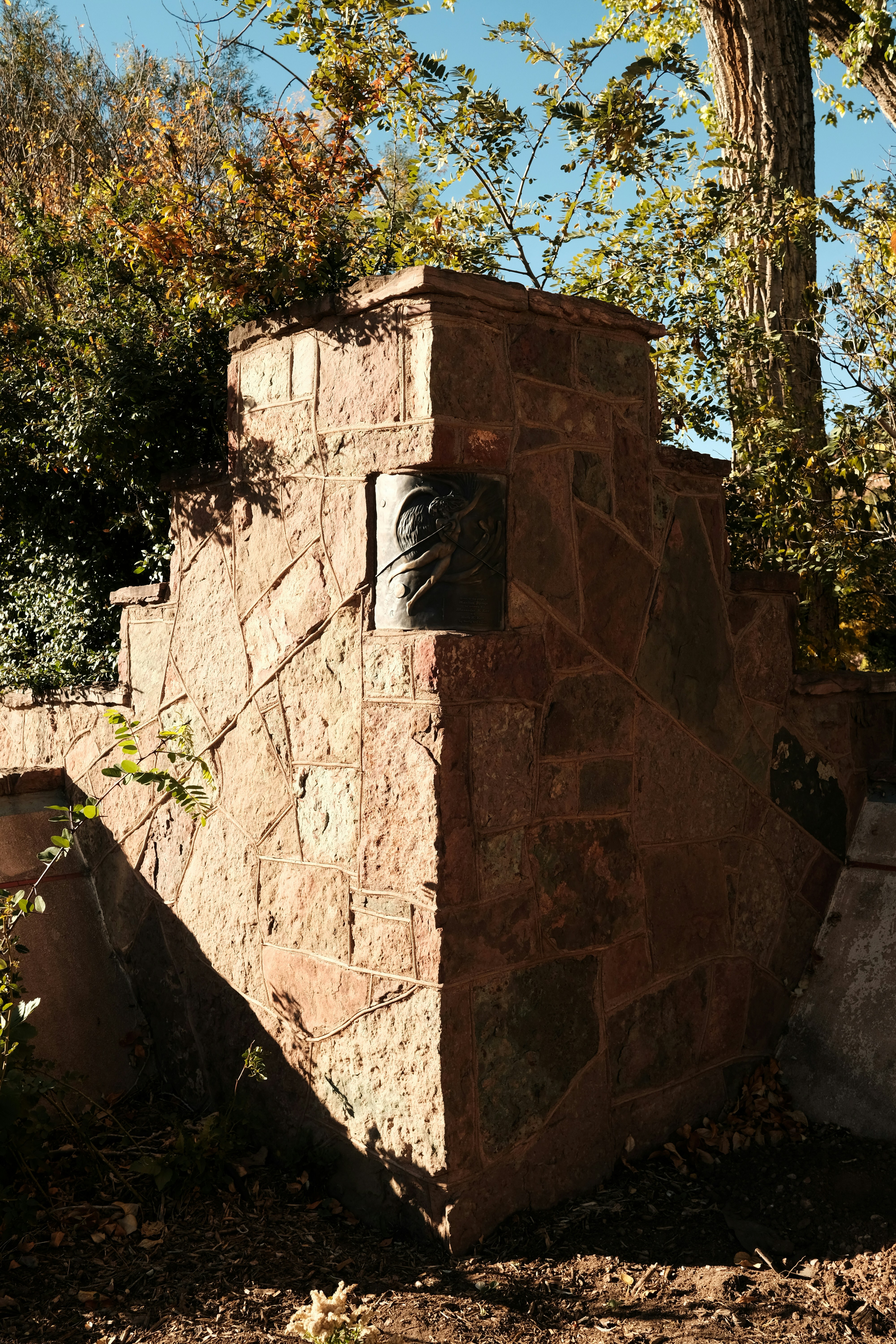 Autumn Light on a Weathered Stone Monument