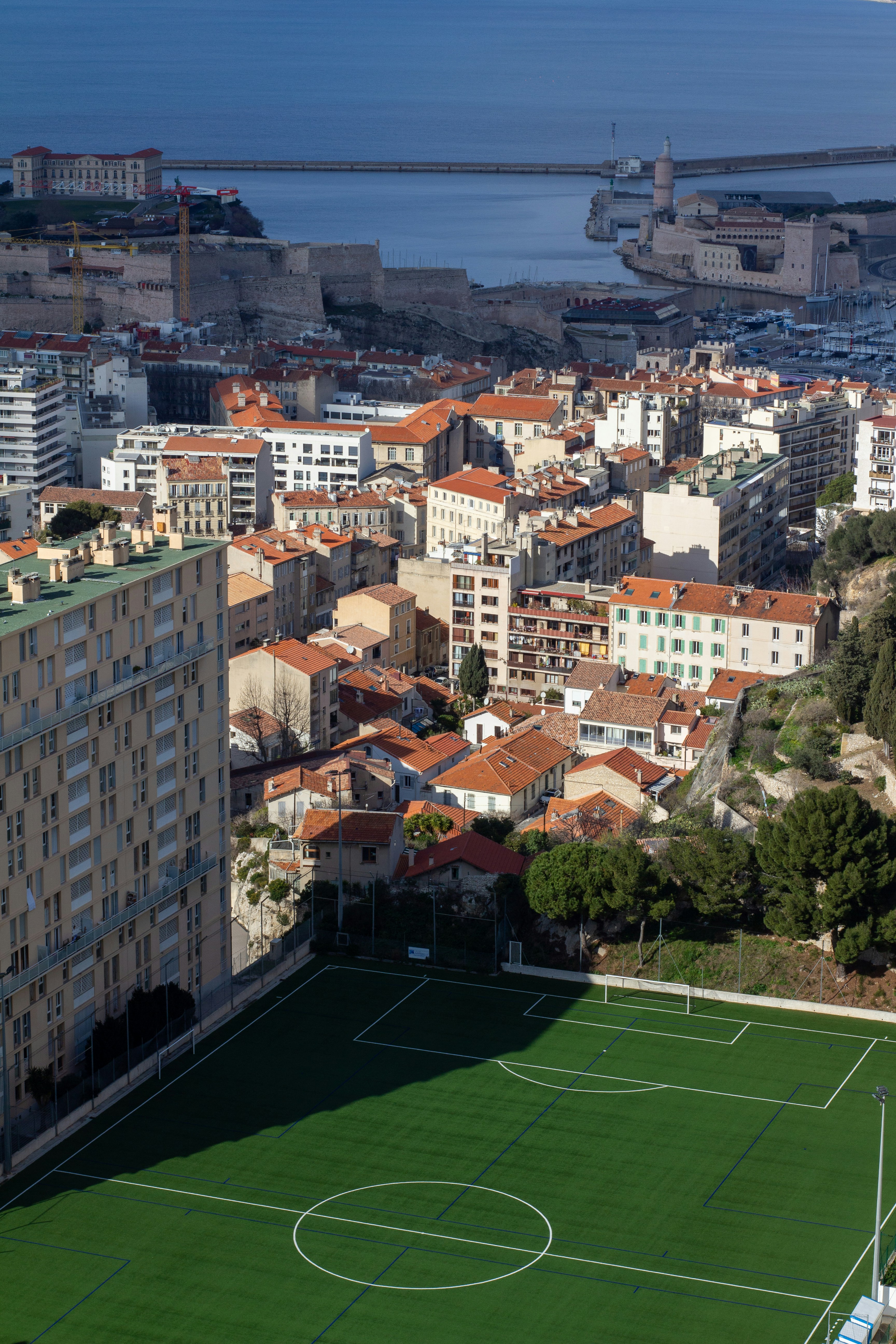 a soccer field in the middle of a city
