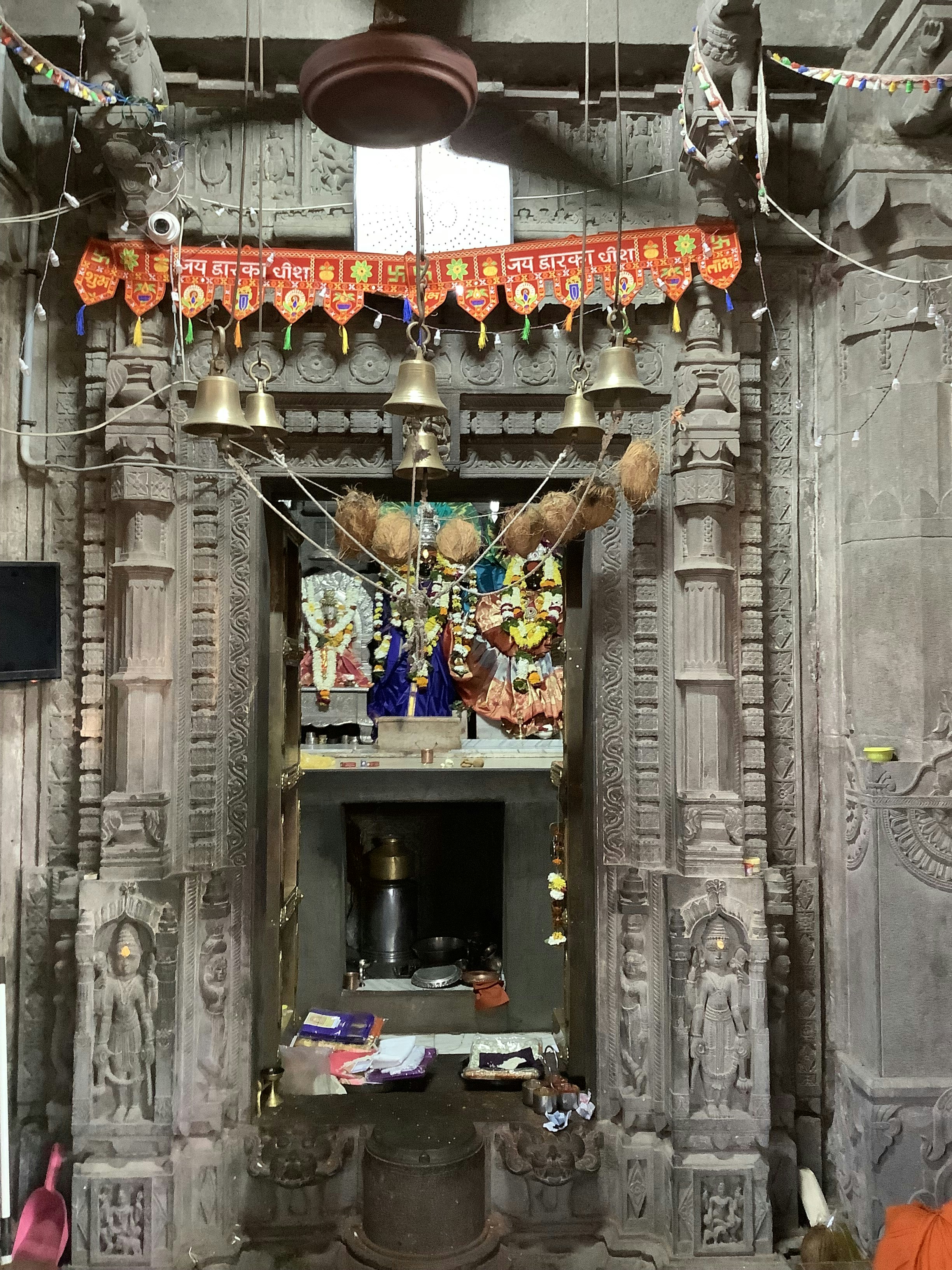 A shrine with bells and decorations hanging from the ceiling photo ...