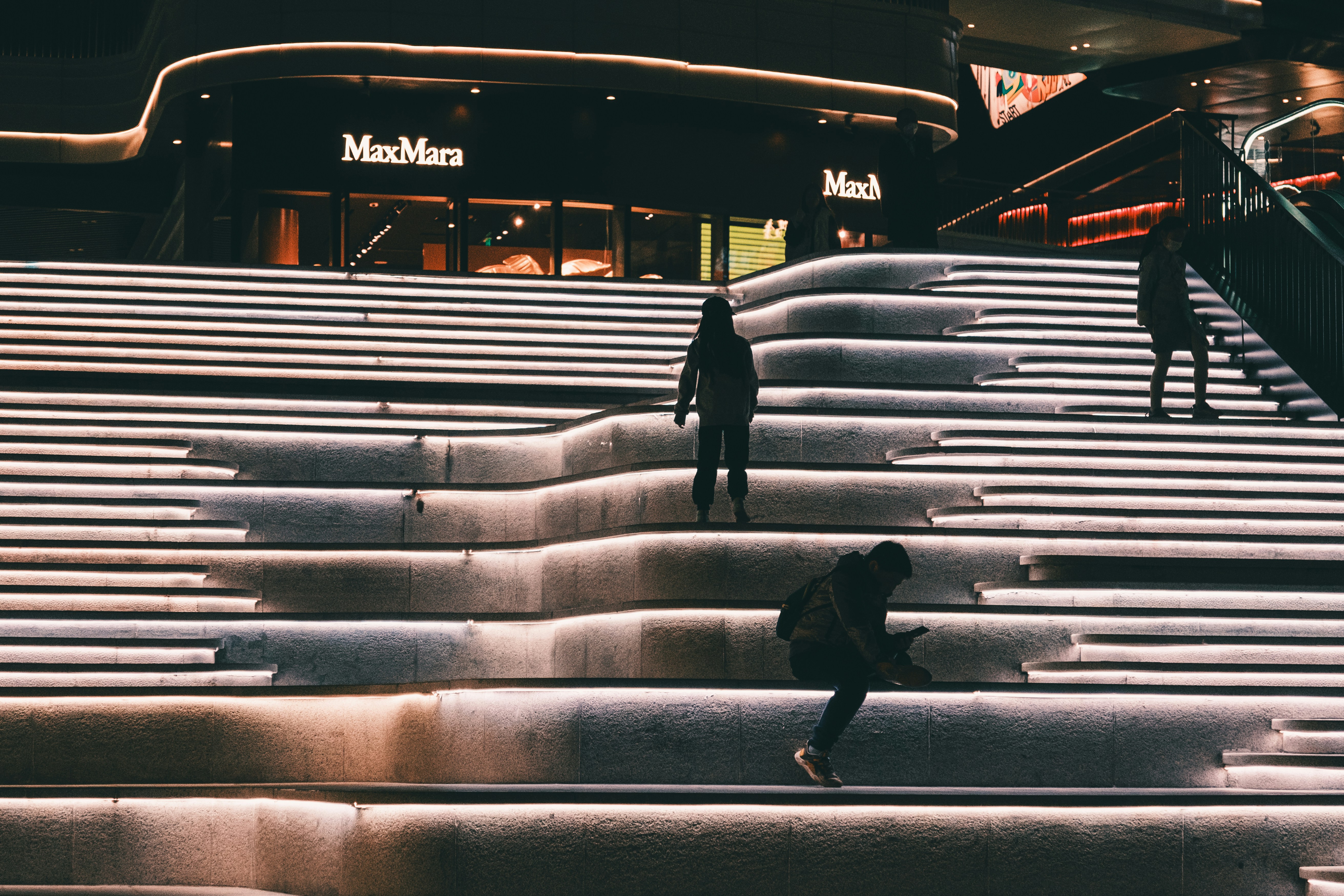 A couple of people that are standing on some steps photo – Free ...