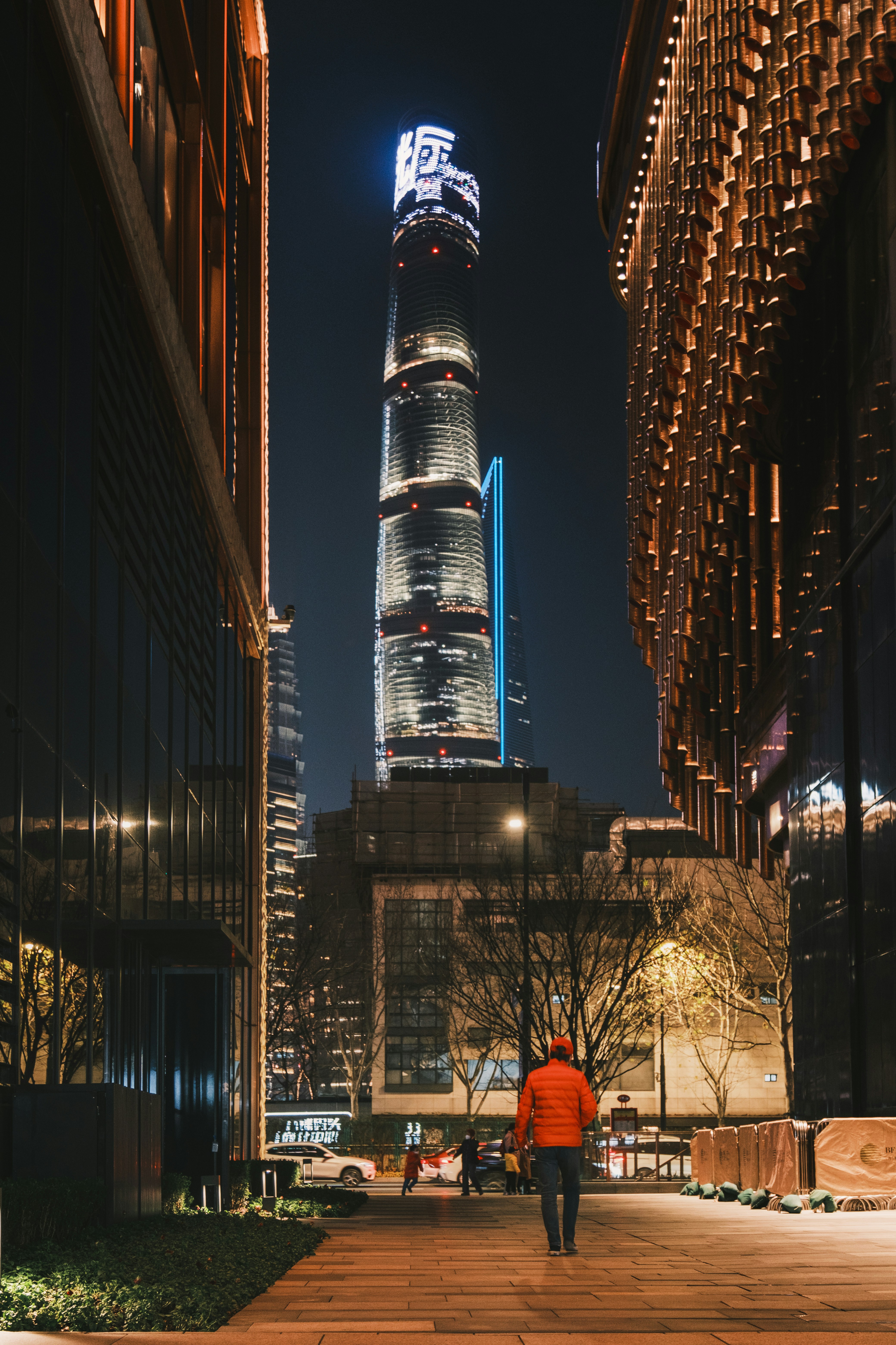 Footsteps Toward the Spire: Night Corridor Between Glass Giants