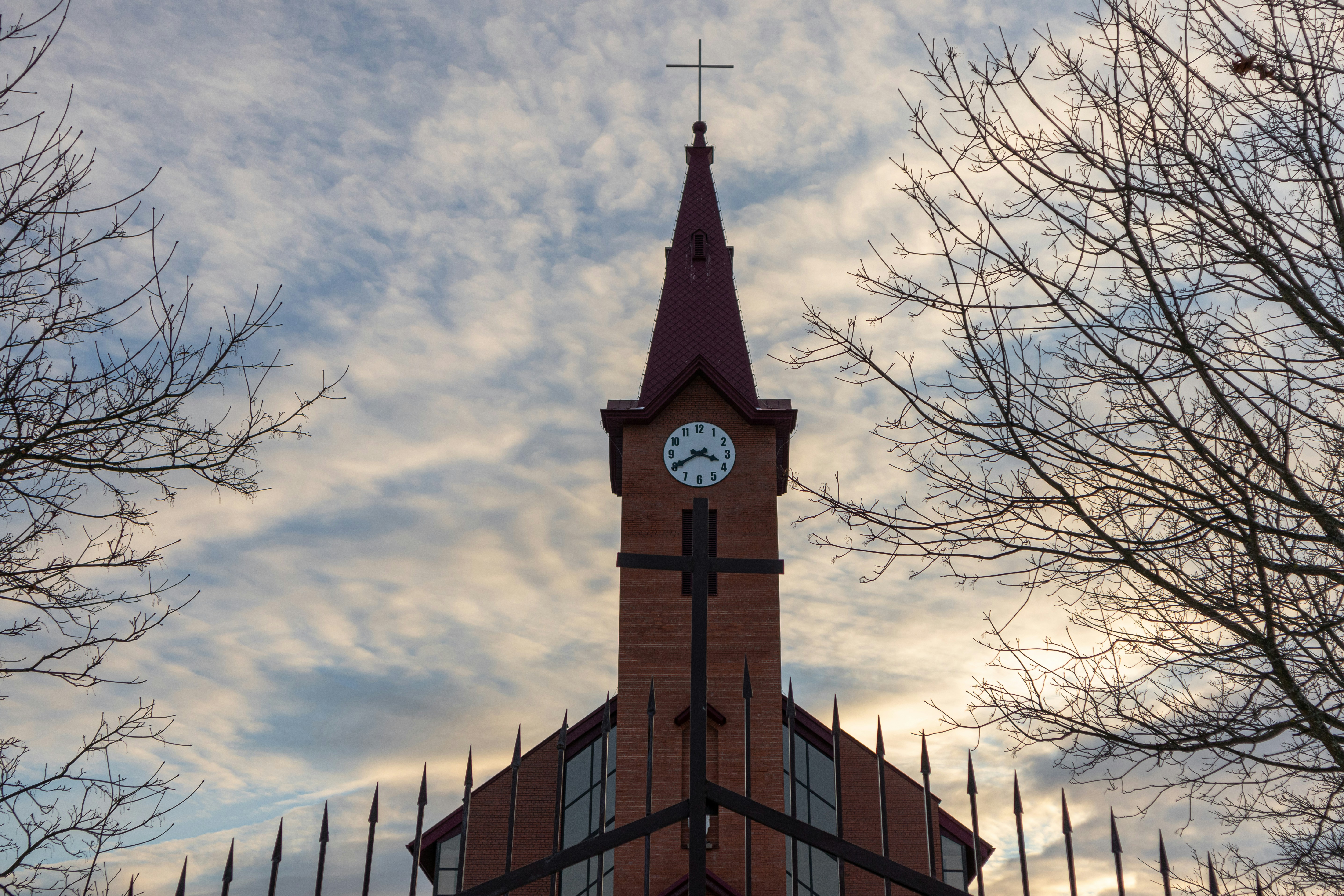 a church steeple with a clock at the top
