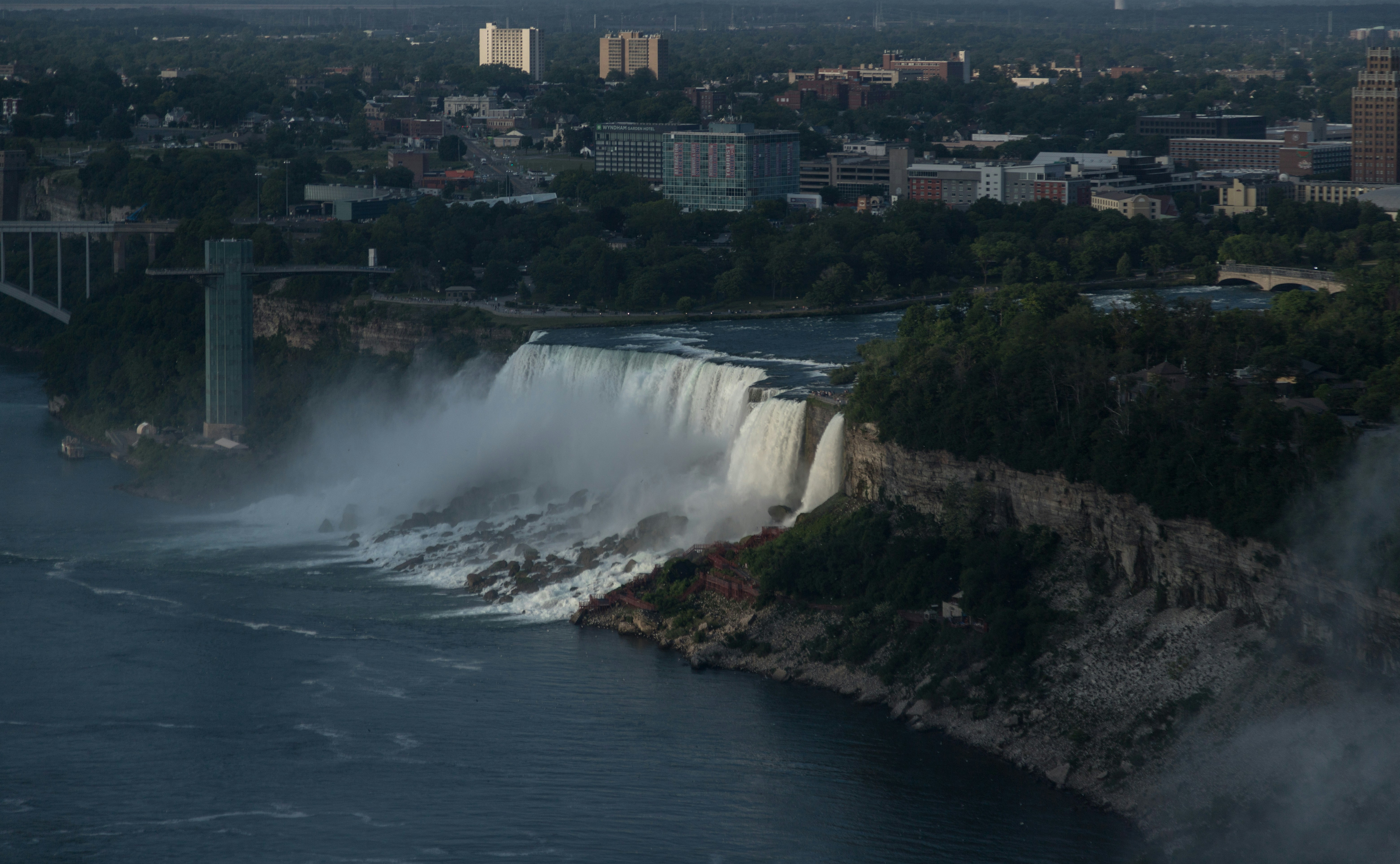 A view of niagara falls and the city in the background photo – Free ...