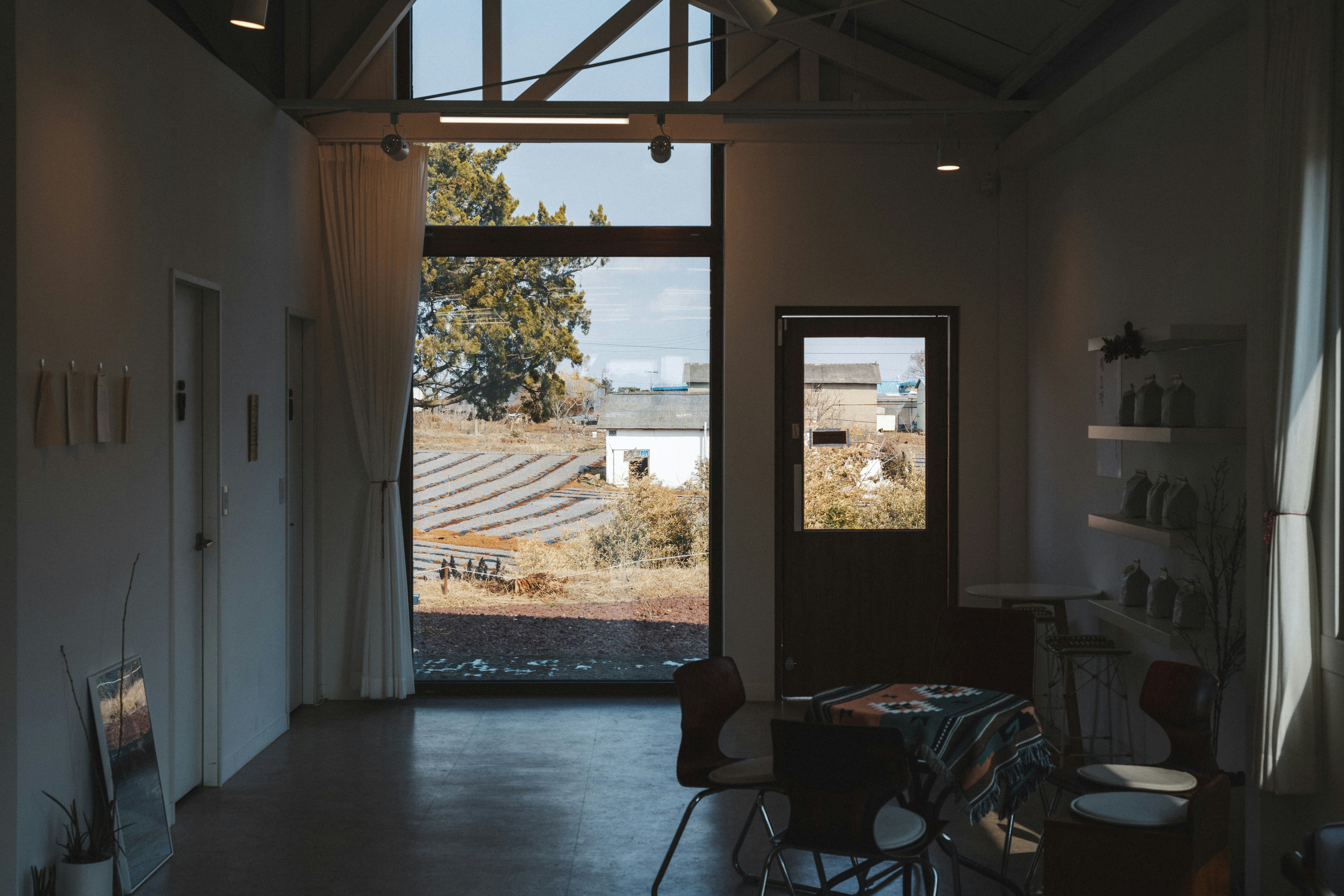 A room with a large open door leading to a stage photo – Free Interior ...