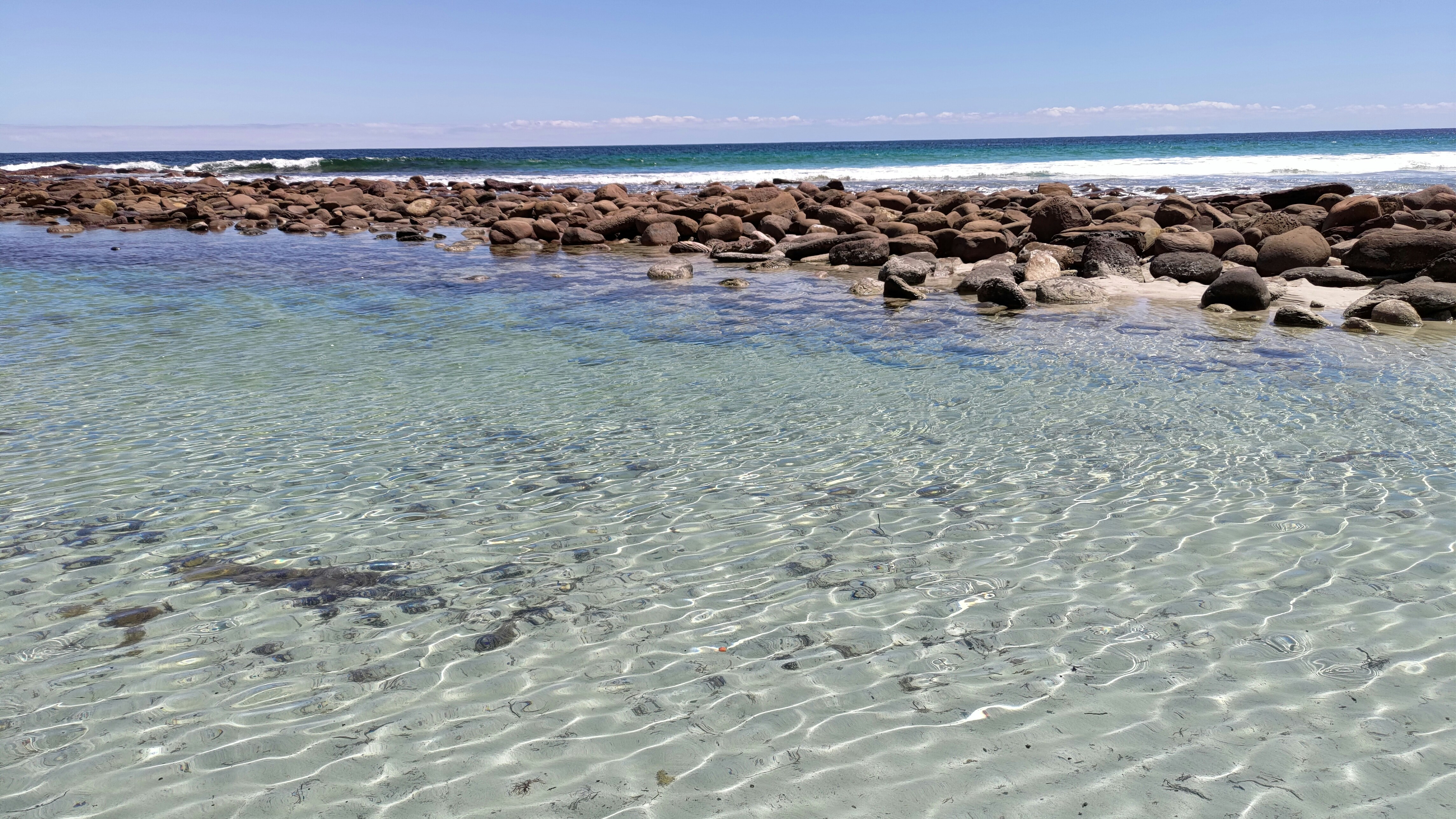 A body of water with rocks in it photo – Free Stokes bay sa Image on ...