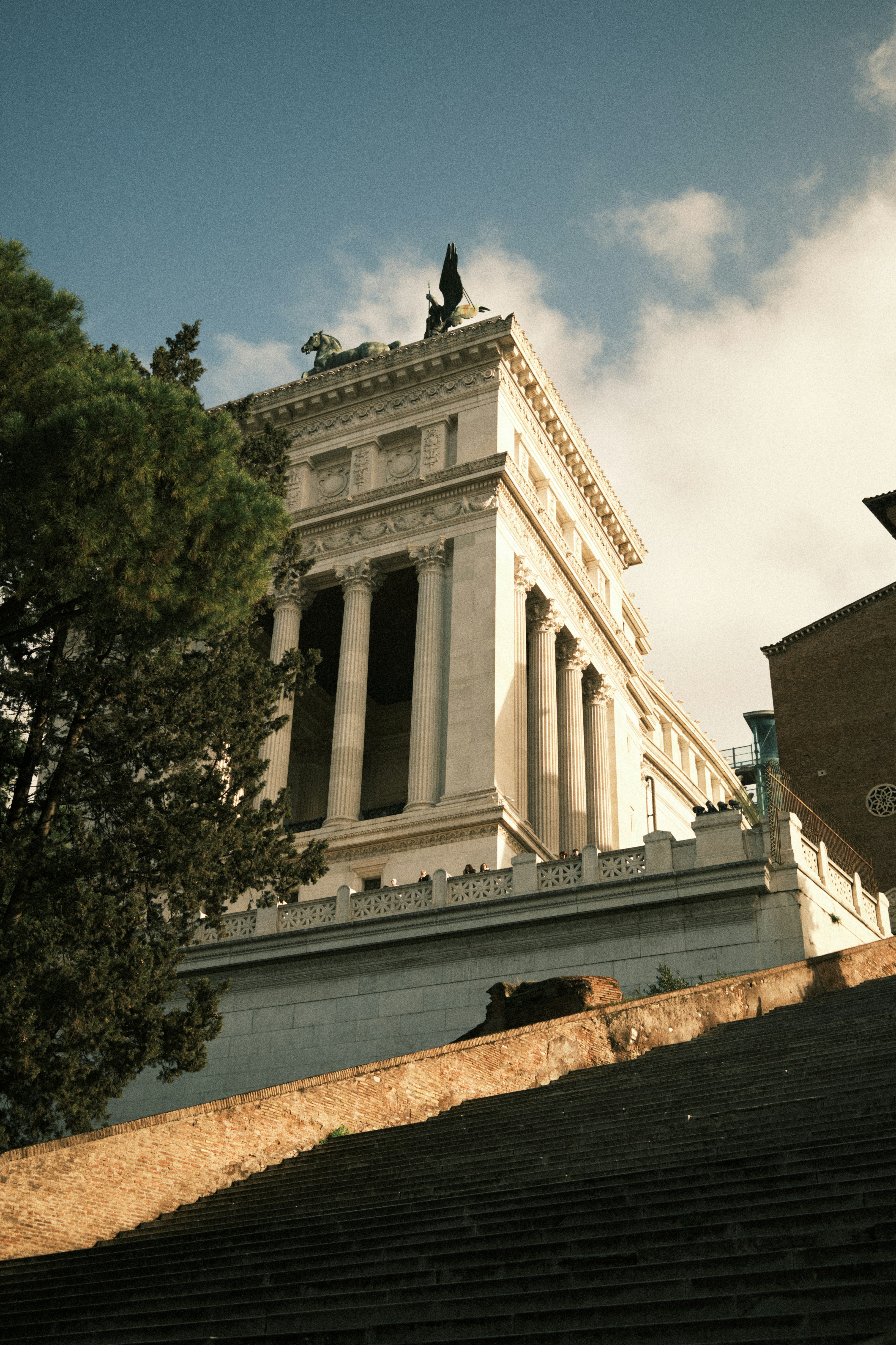 A tall building with a clock on top of it photo – Free Altare della ...