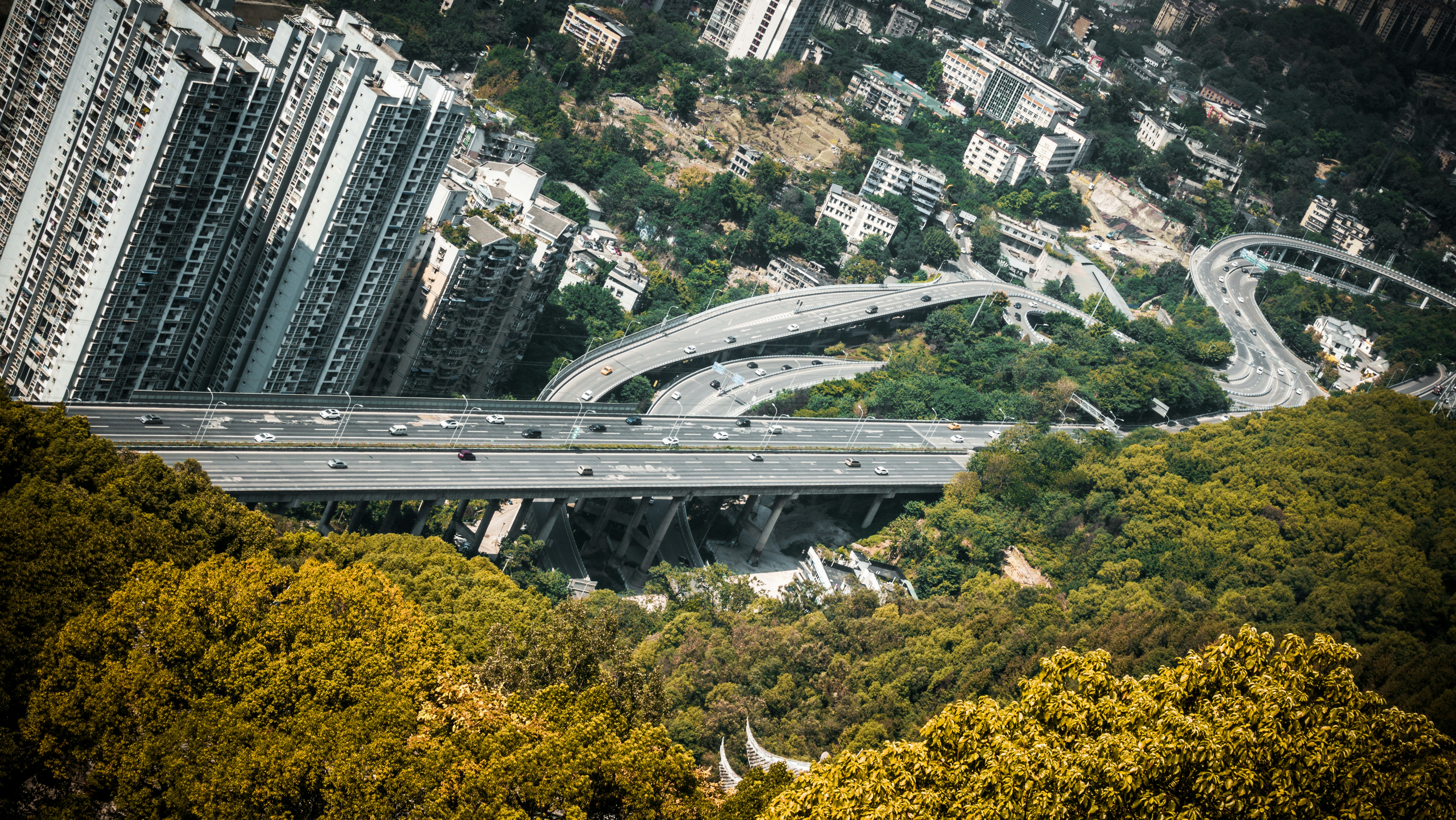 an aerial view of a highway in a city