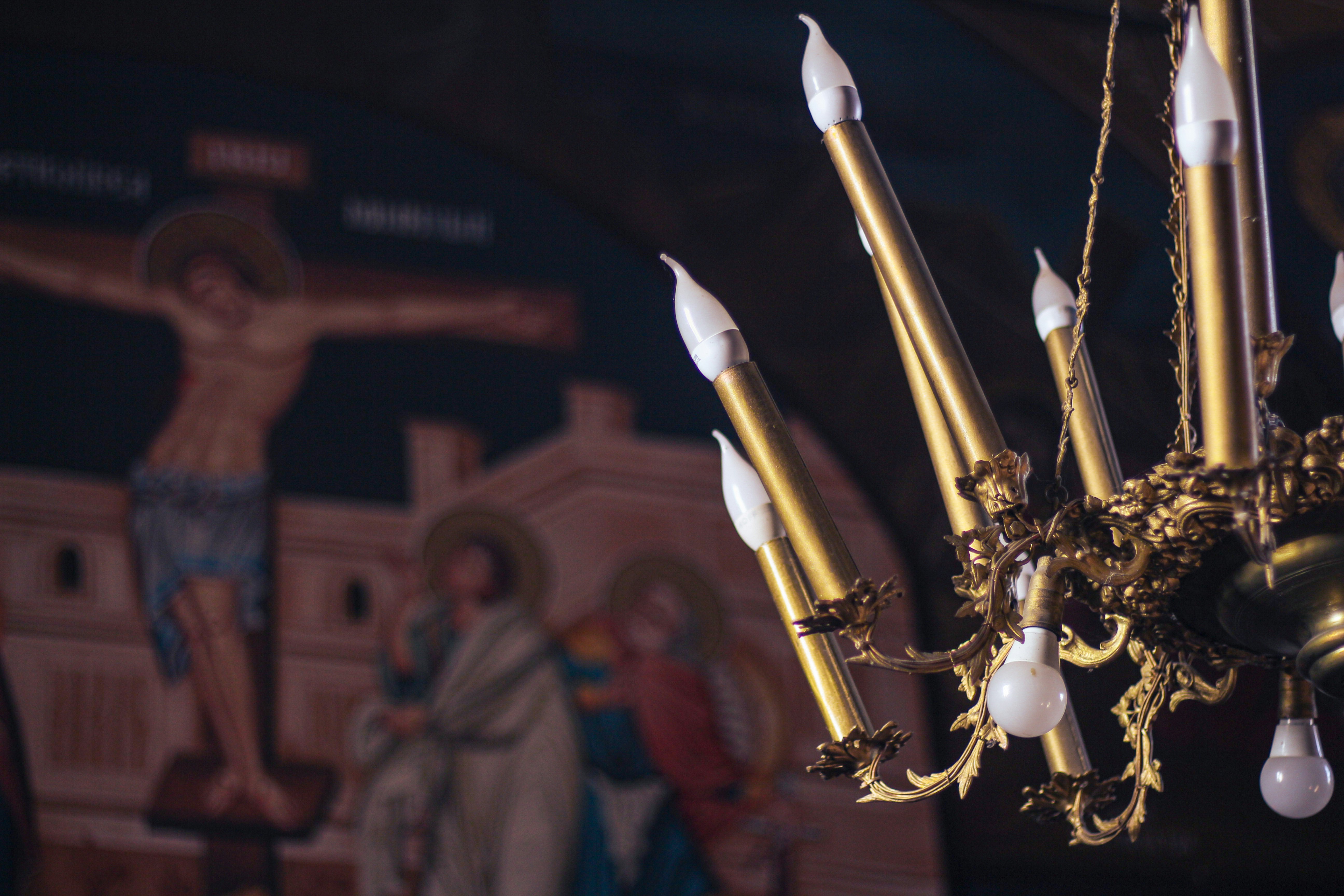 a chandelier with candles hanging from it