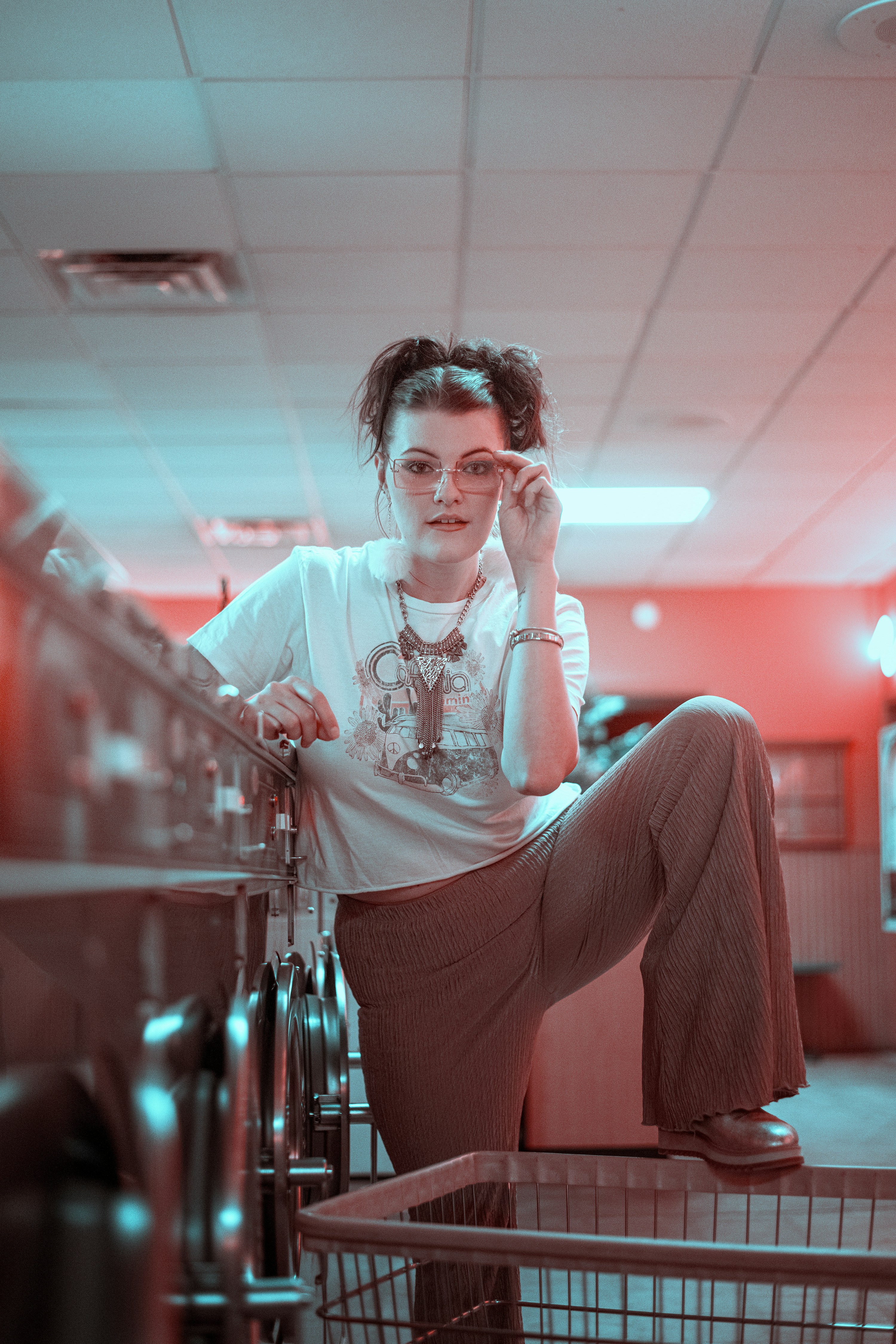Neon Portrait in a Laundromat: A Quiet Rebel Under Cyan and Crimson