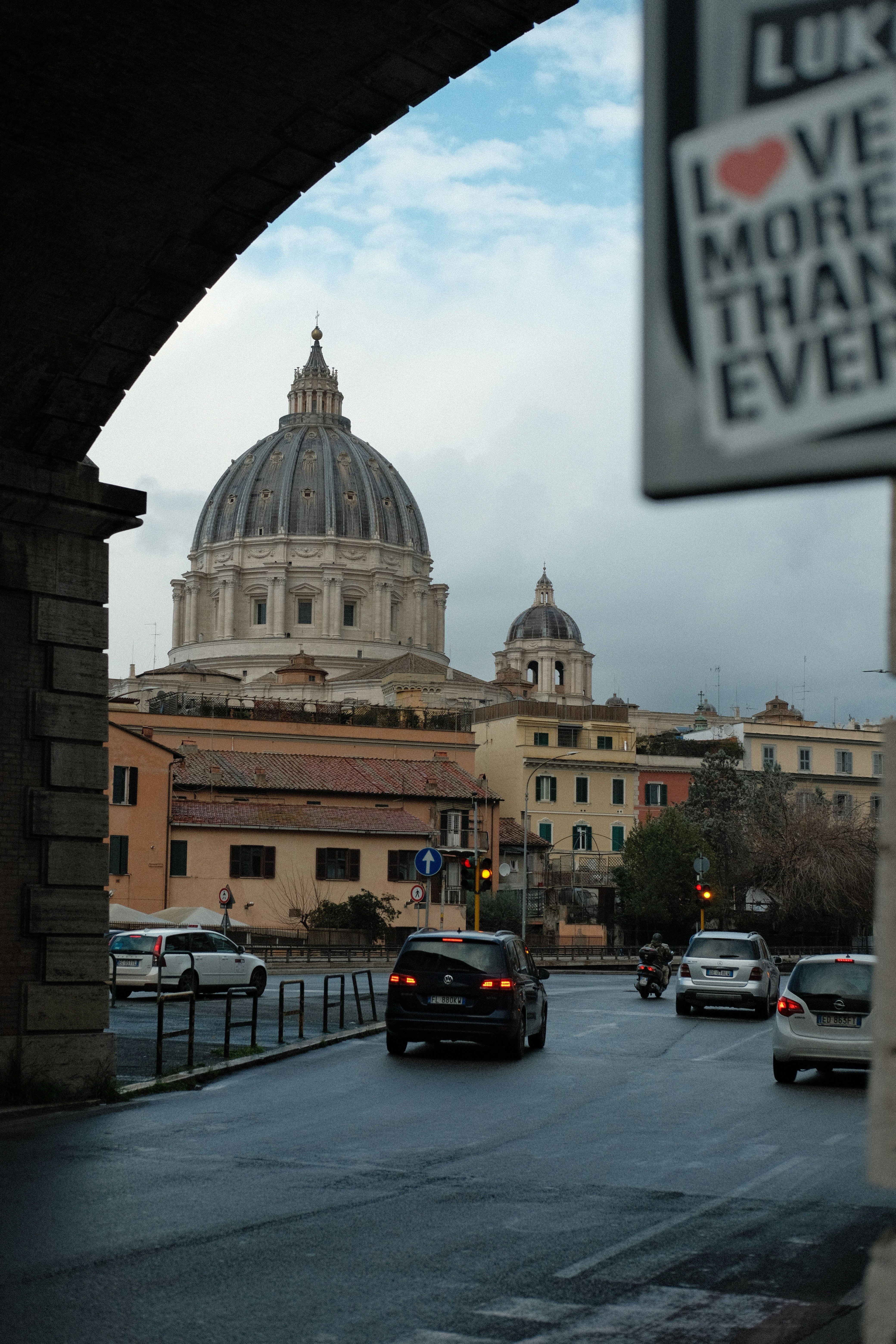 Rome from the Arch: St. Peter's Dome Framed by a Street Scene