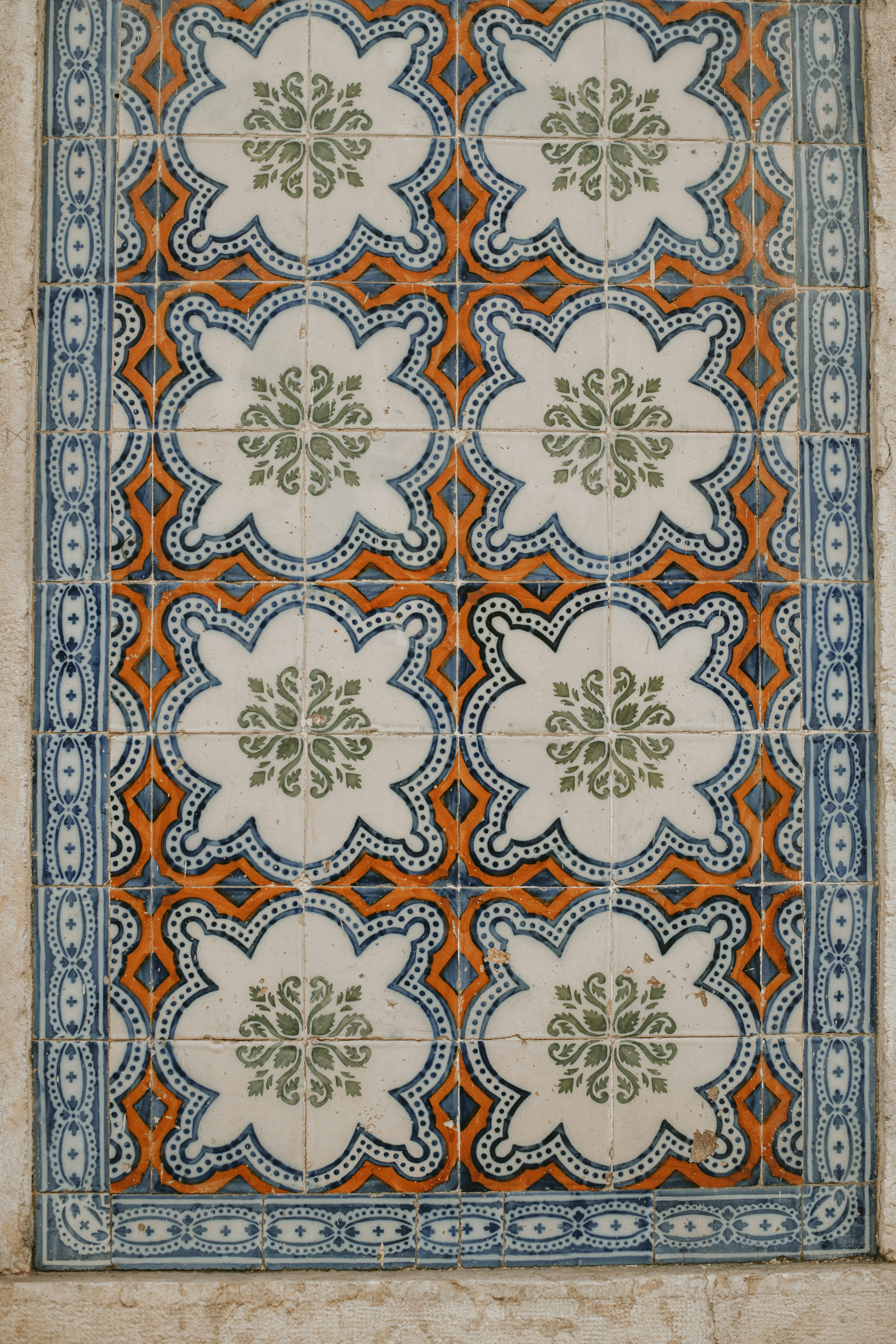 A close up of a tile design on a wall photo – Free Pattern Image on ...