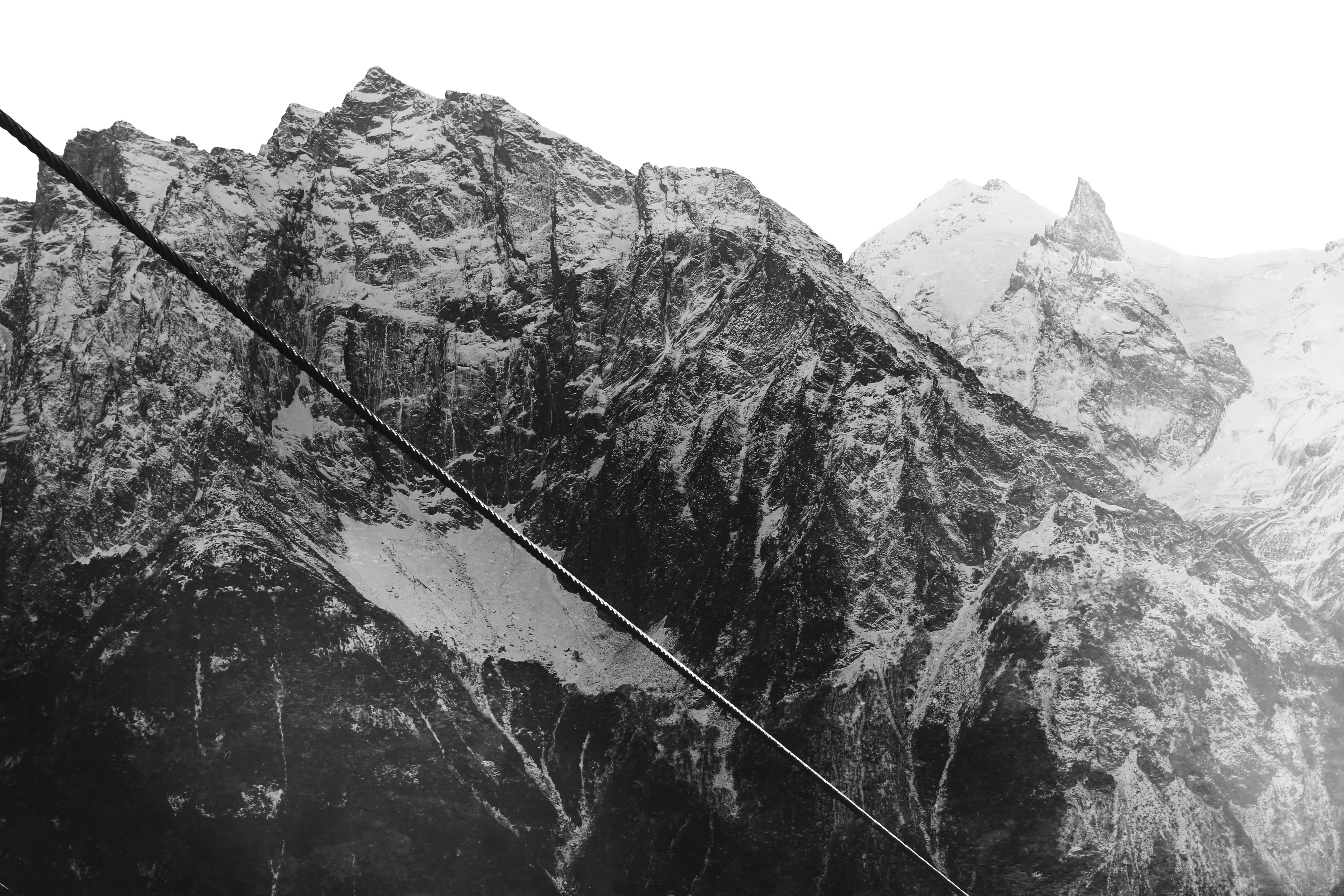 Diagonal Line Cuts Snowy Peakline