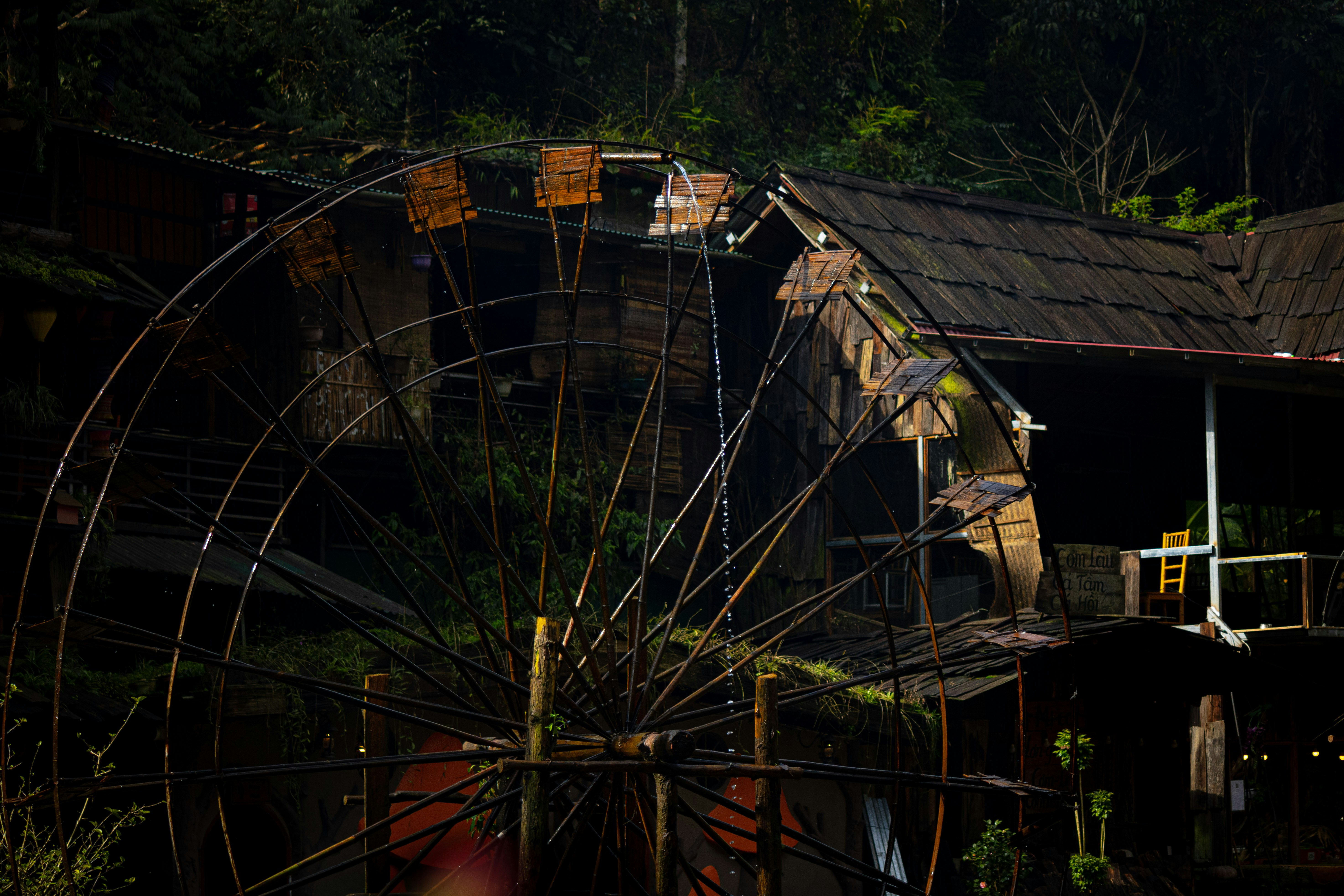 Spokes in Shadow: a Dusk Wheel Kept by Timbered Huts
