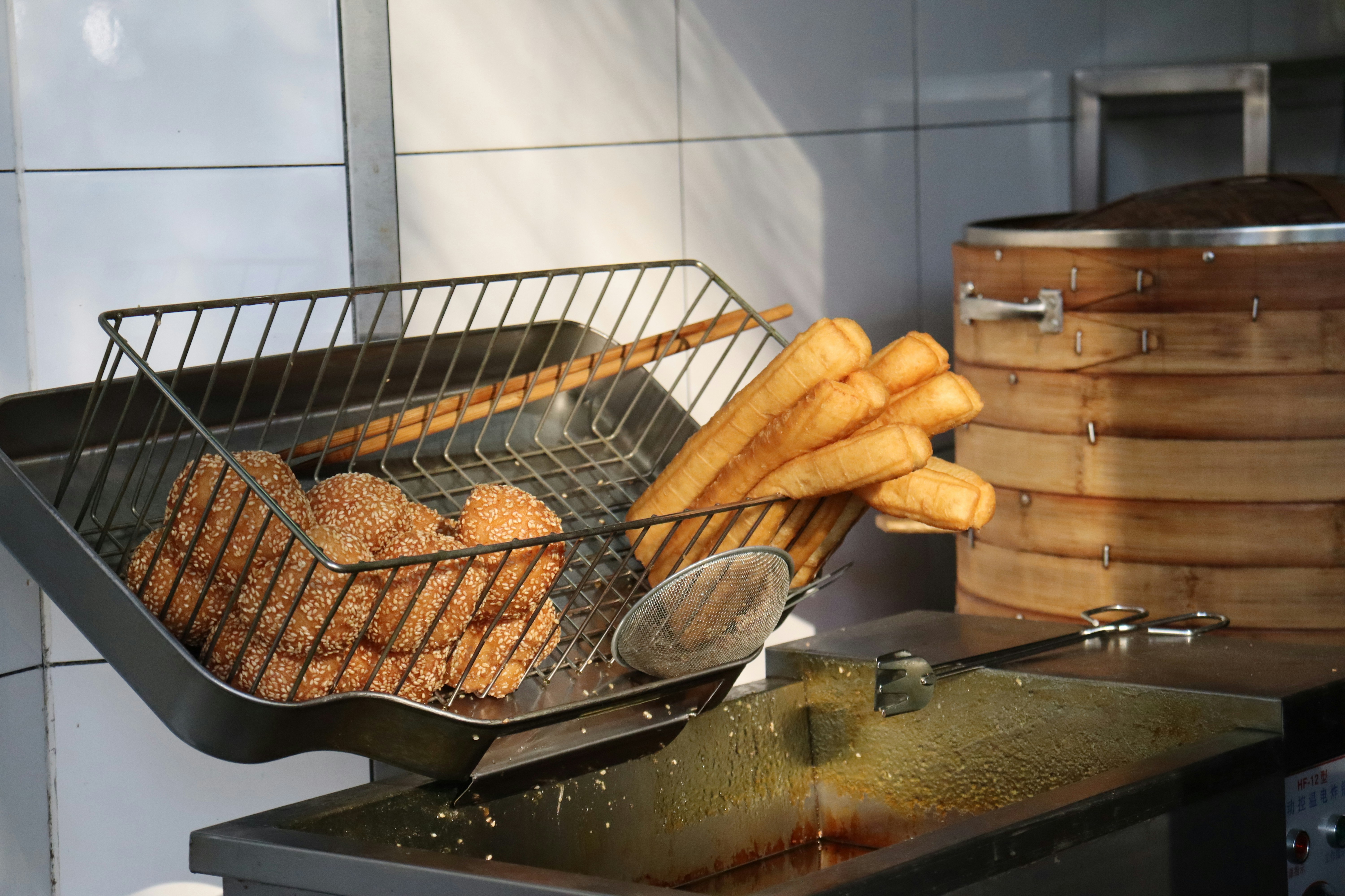 Basket Crisp: Golden Sticks Above Open Oil