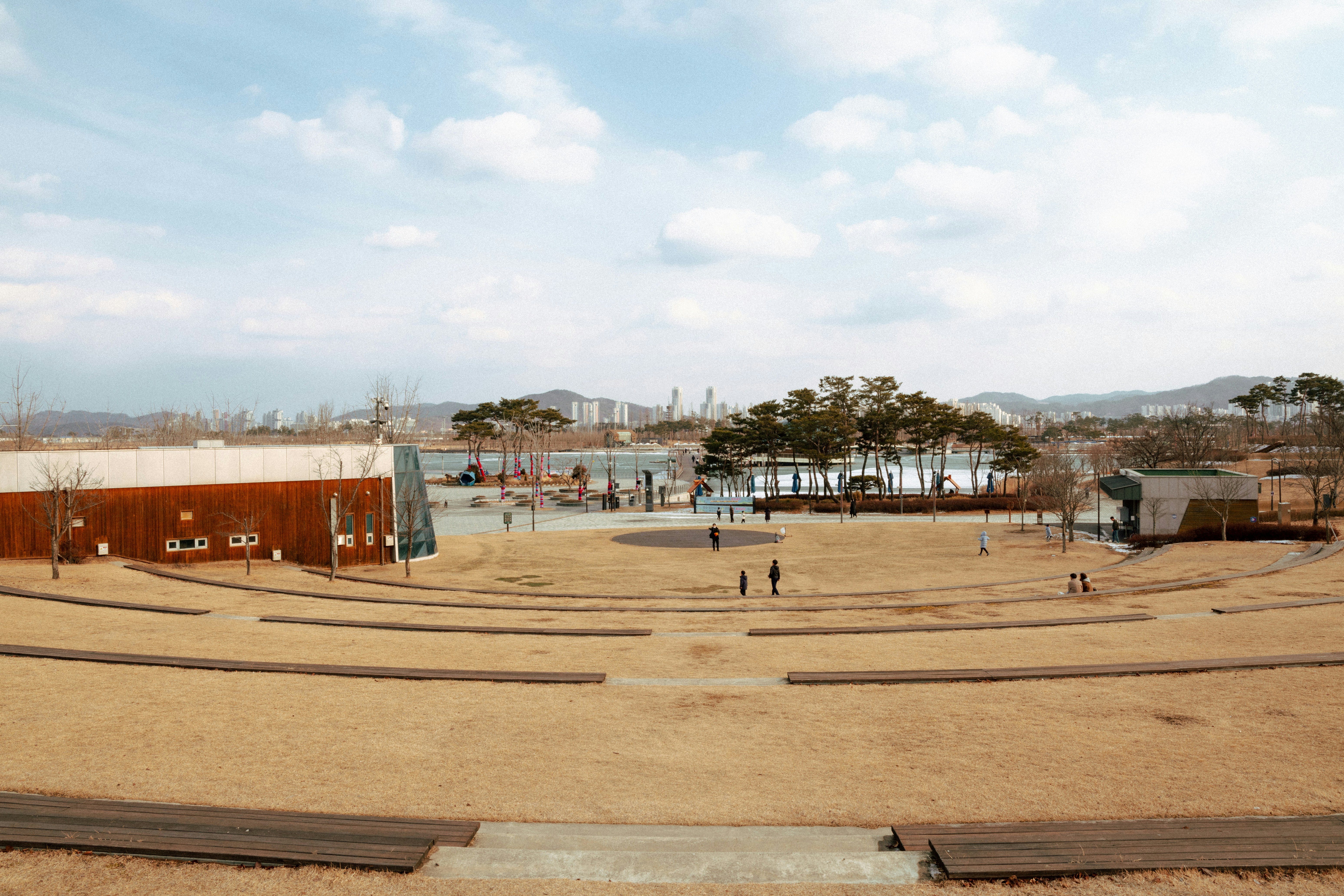a large open area with a few people walking around