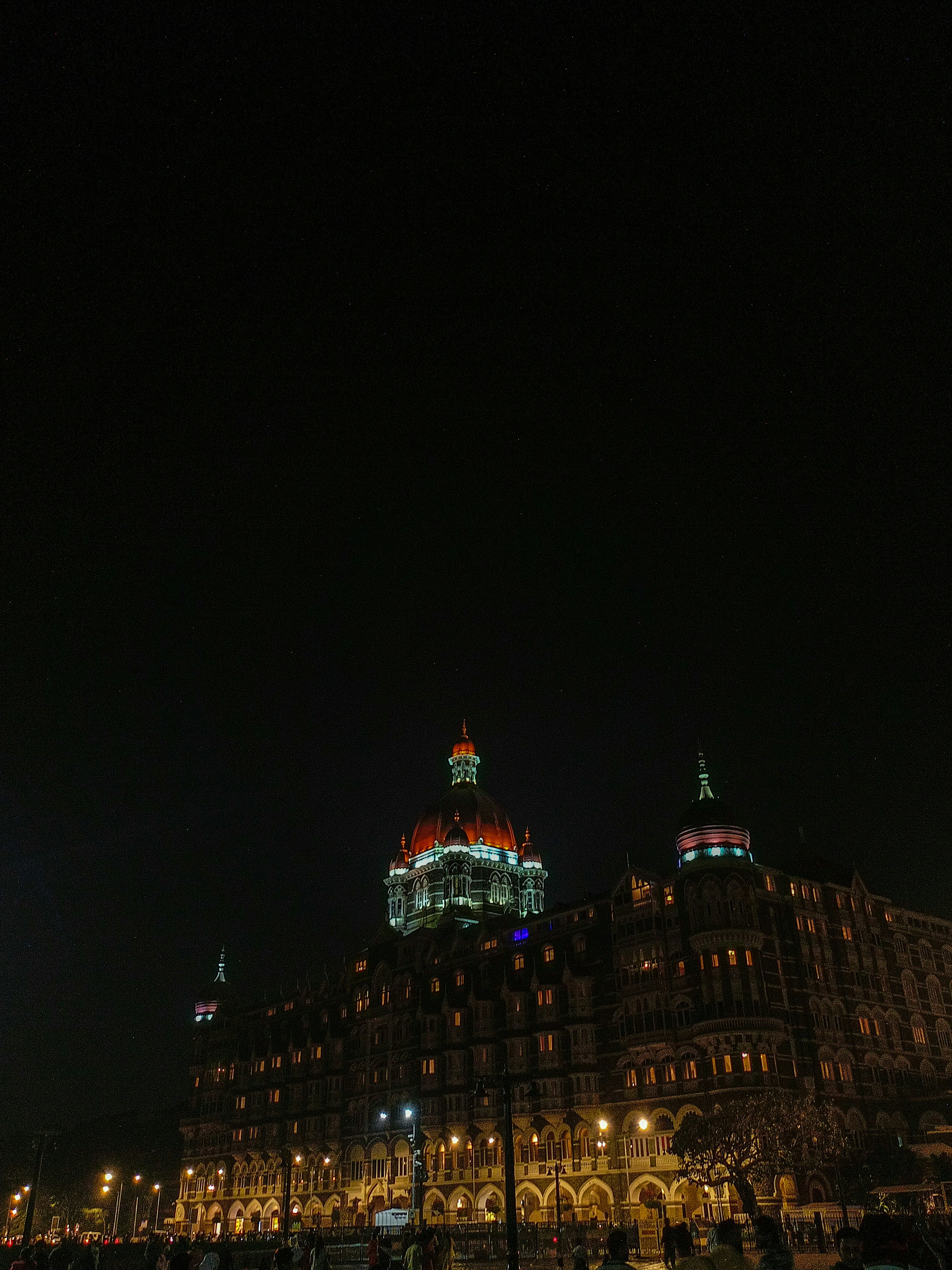 Dome of Night: A Warmly Lit Historic Facade Under a Starry Sky
