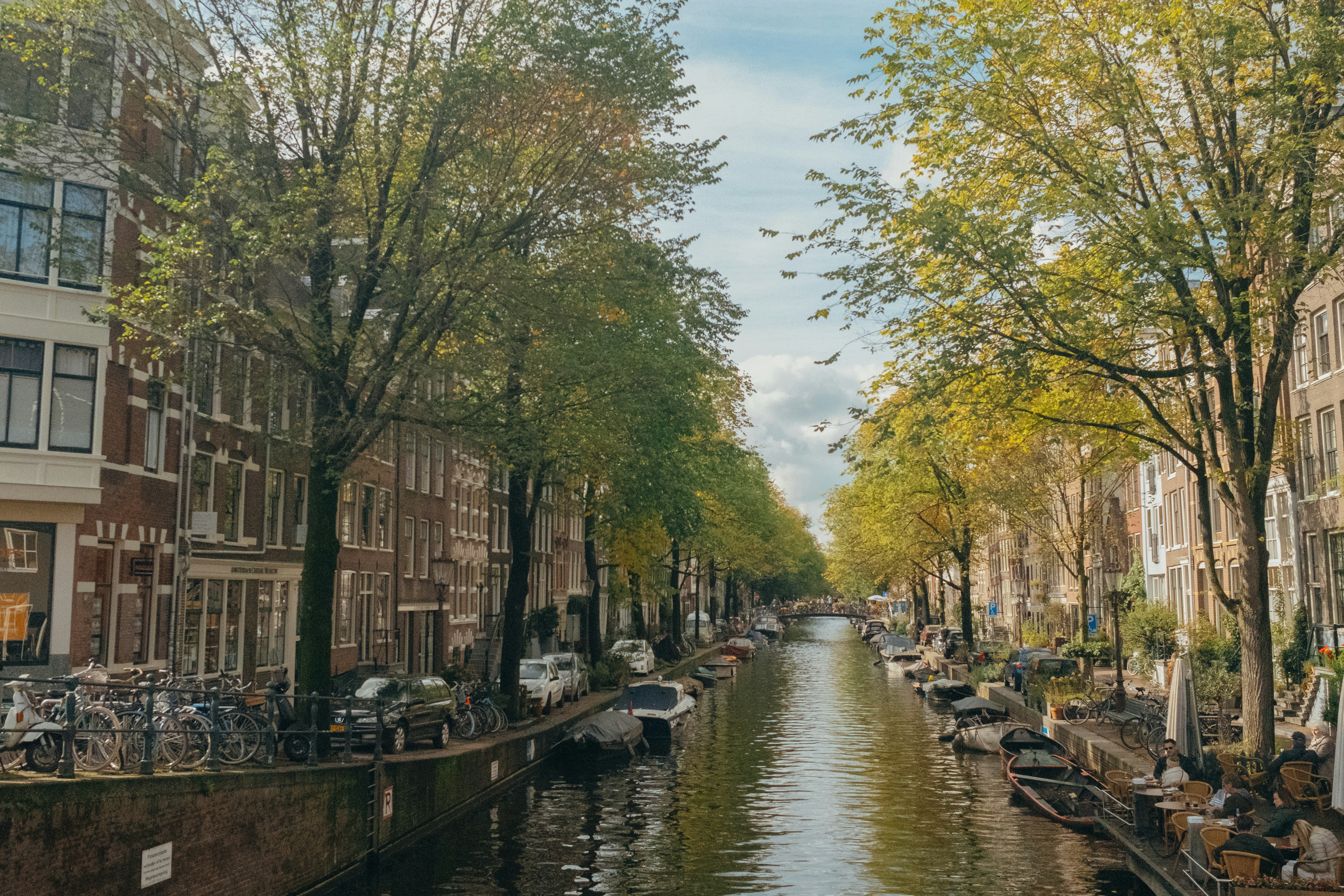 A canal runs through a city surrounded by tall buildings photo – Free ...