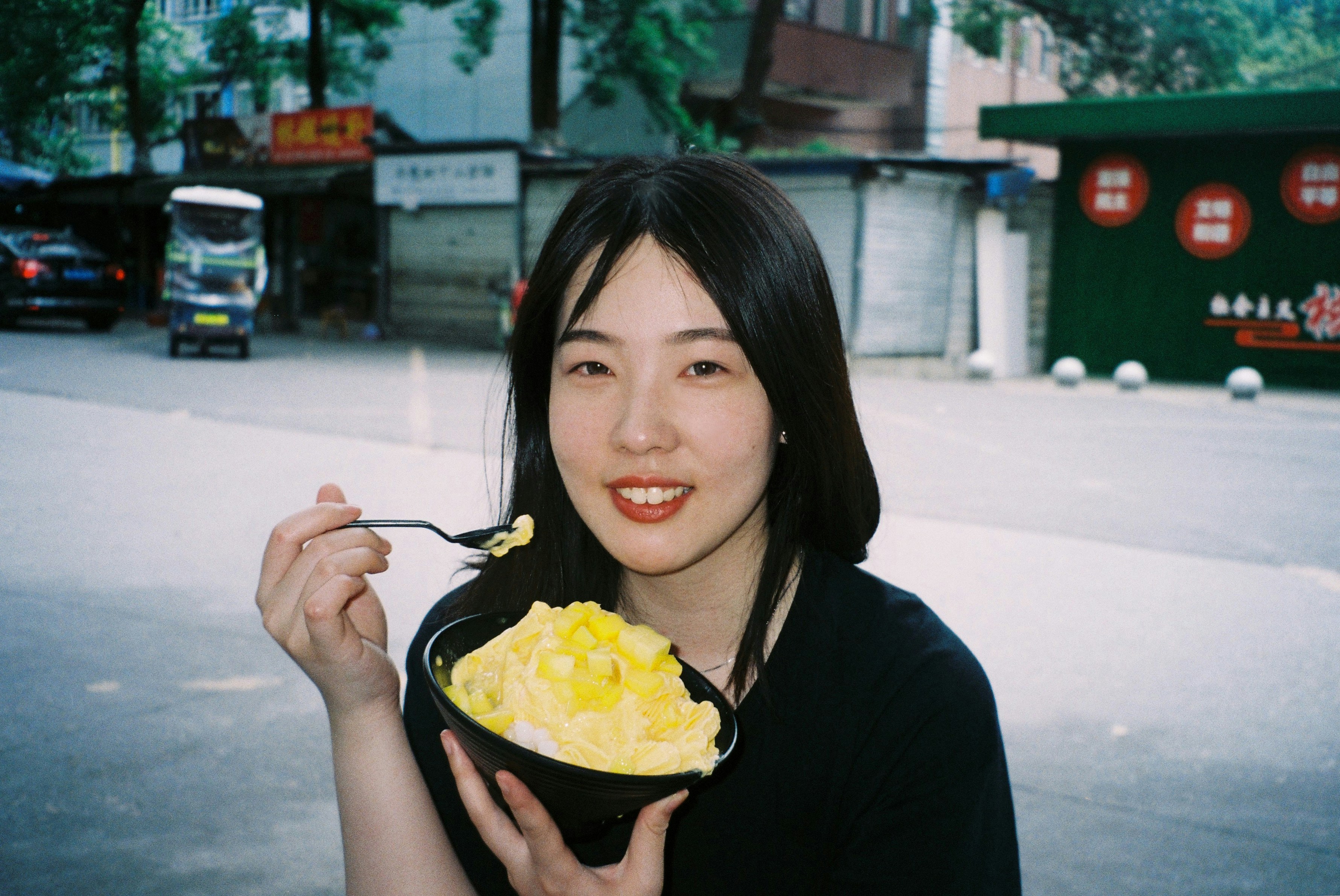 A woman holding a bowl of food and a spoon photo – Free Leshan Image on ...