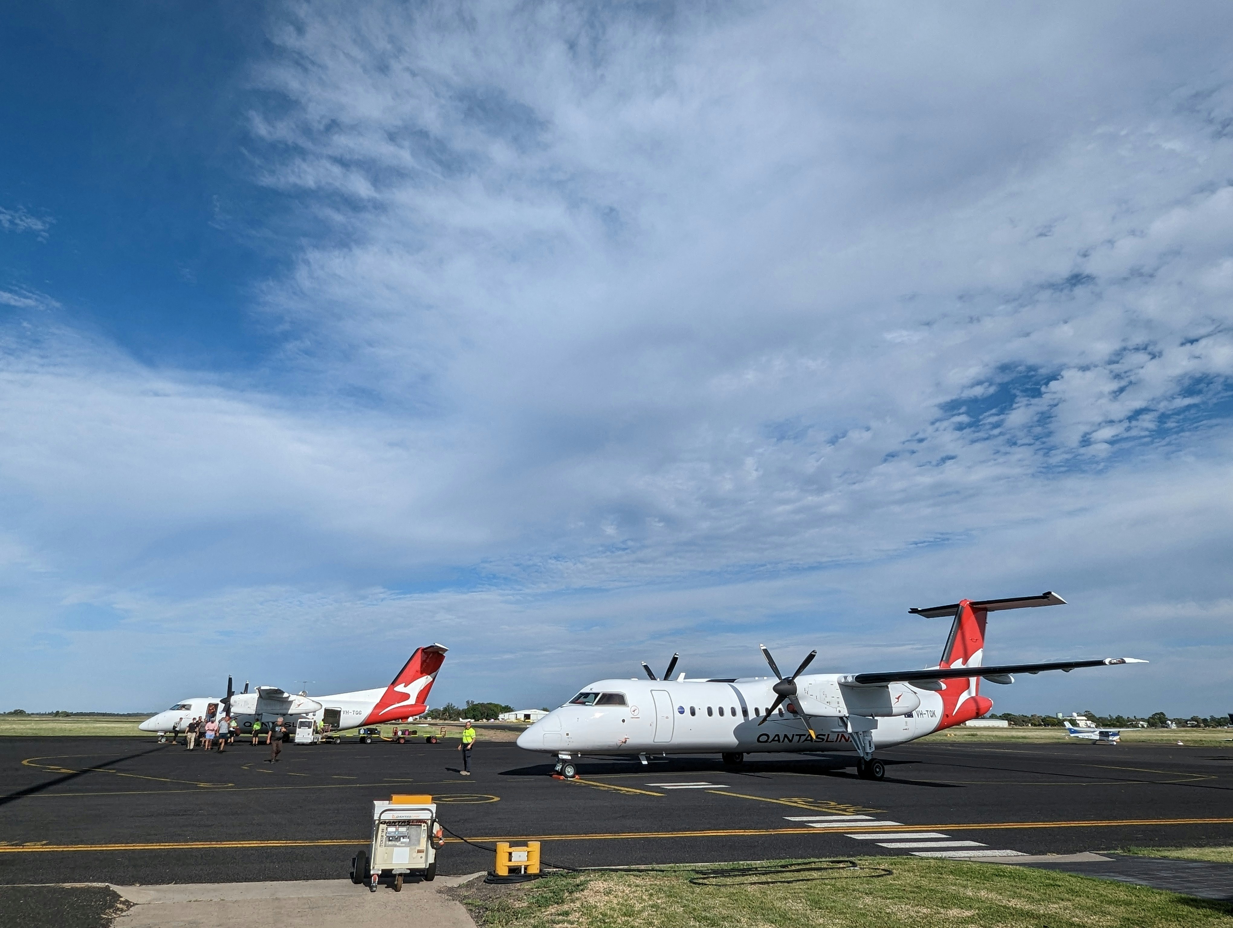 A couple of airplanes that are on a runway photo – Free Moree airport ...