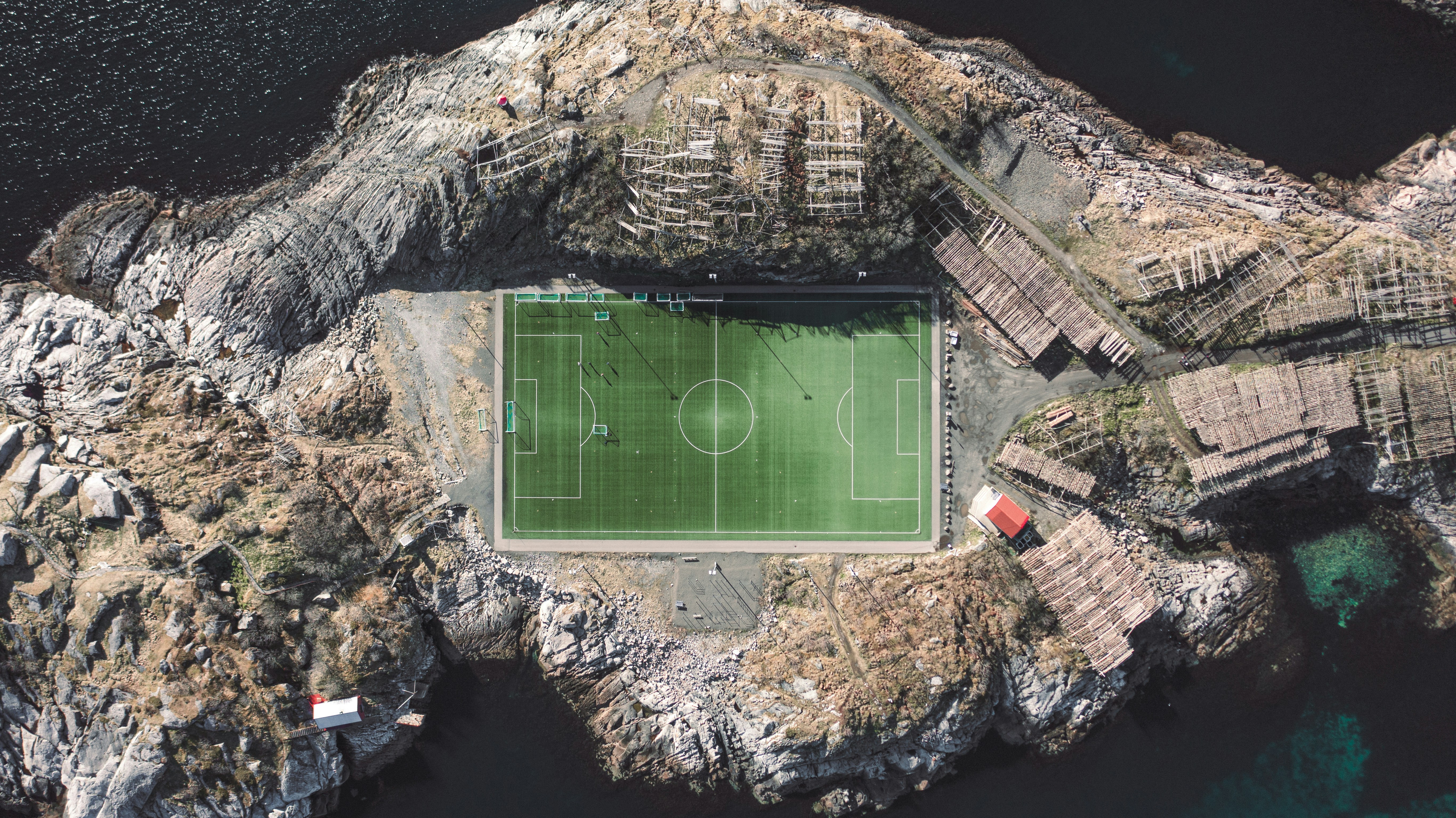 An aerial view of a soccer field in a rocky area photo – Free ...