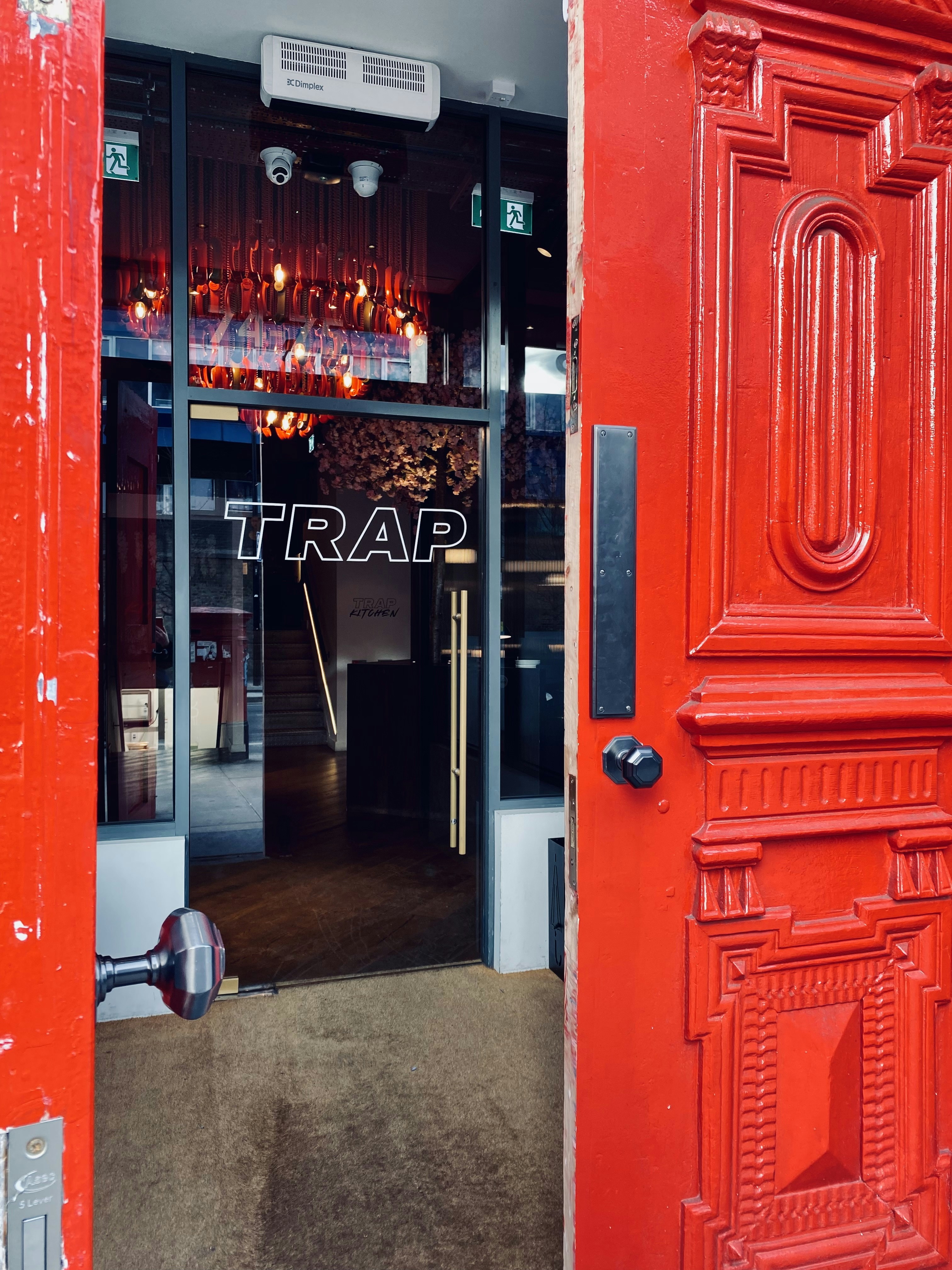 A red door with the word trap on it photo – Free Uk Image on Unsplash