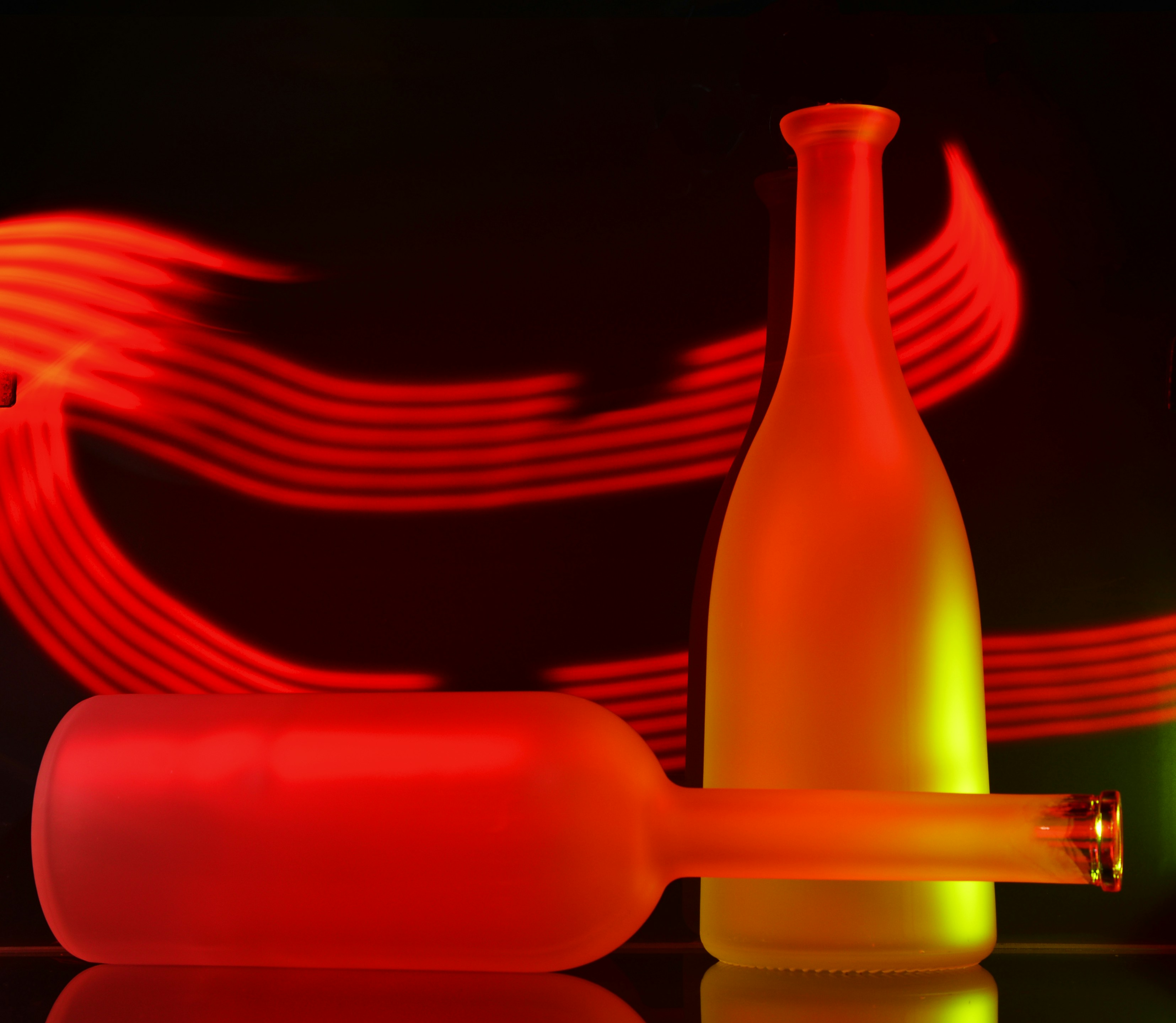 Glowing Bottles in Red Neon Ripples