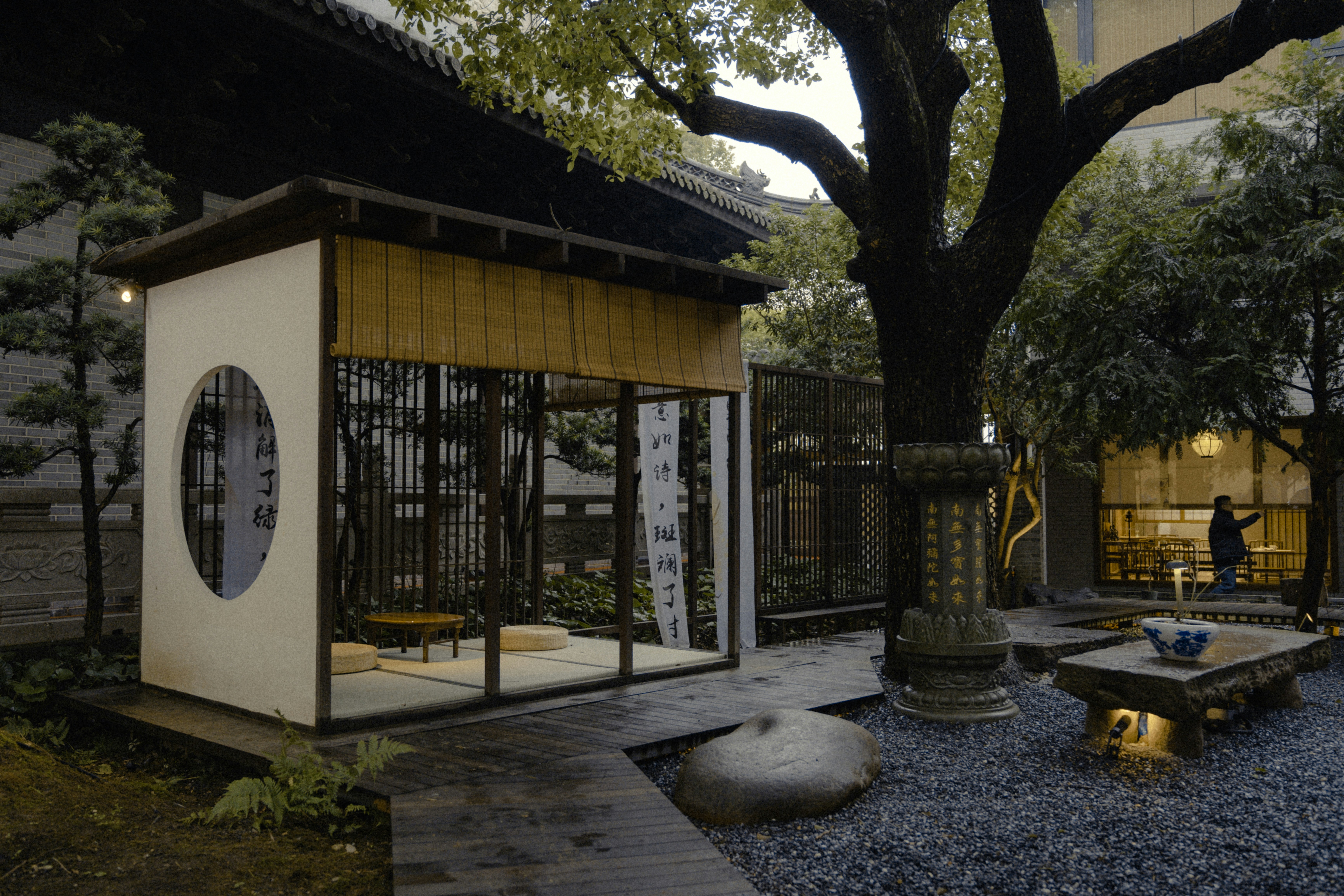 A japanese garden with a tree and benches photo – Free Building Image ...