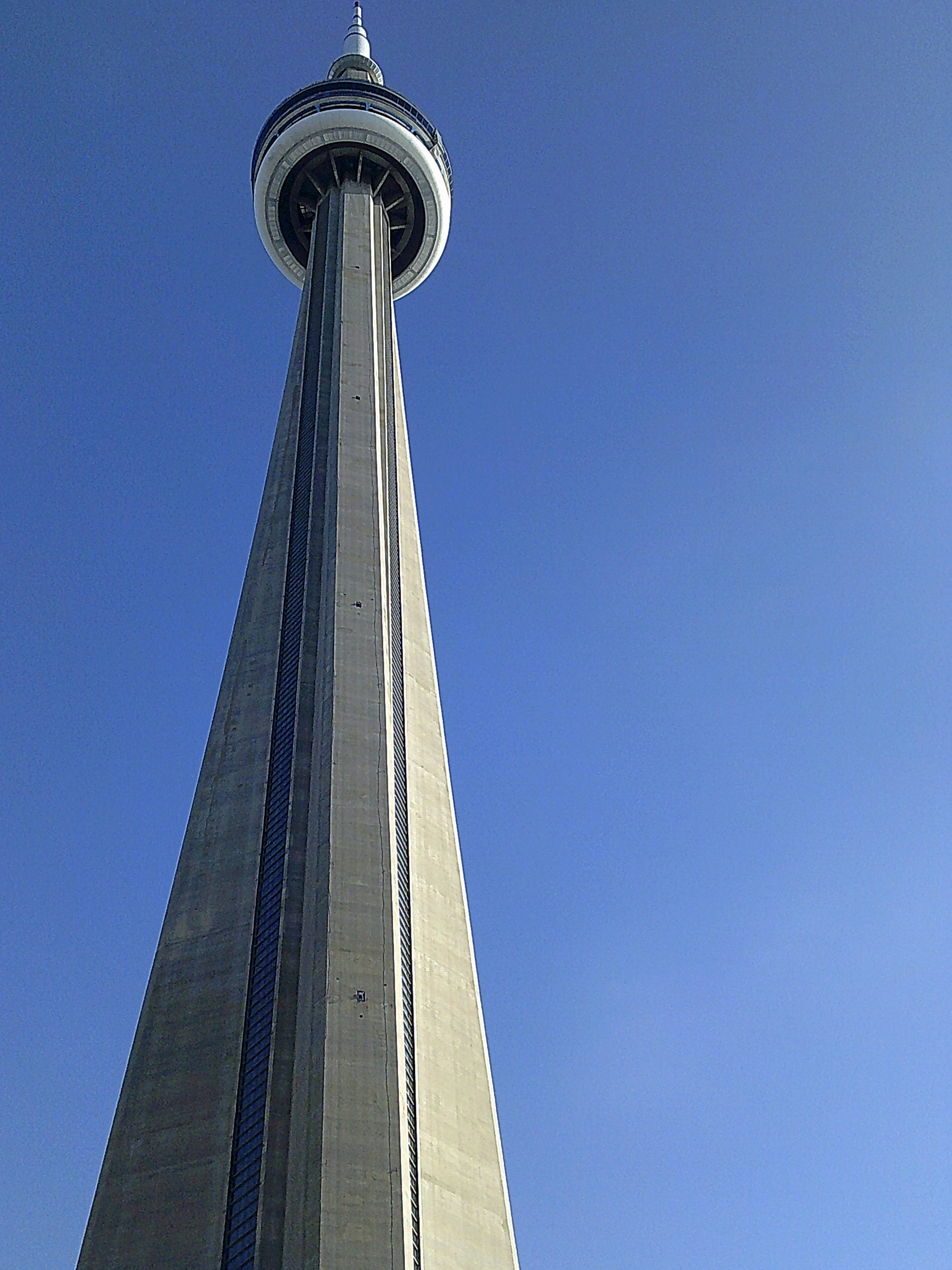 A very tall tower with a clock on it's side photo – Free Toronto Image ...