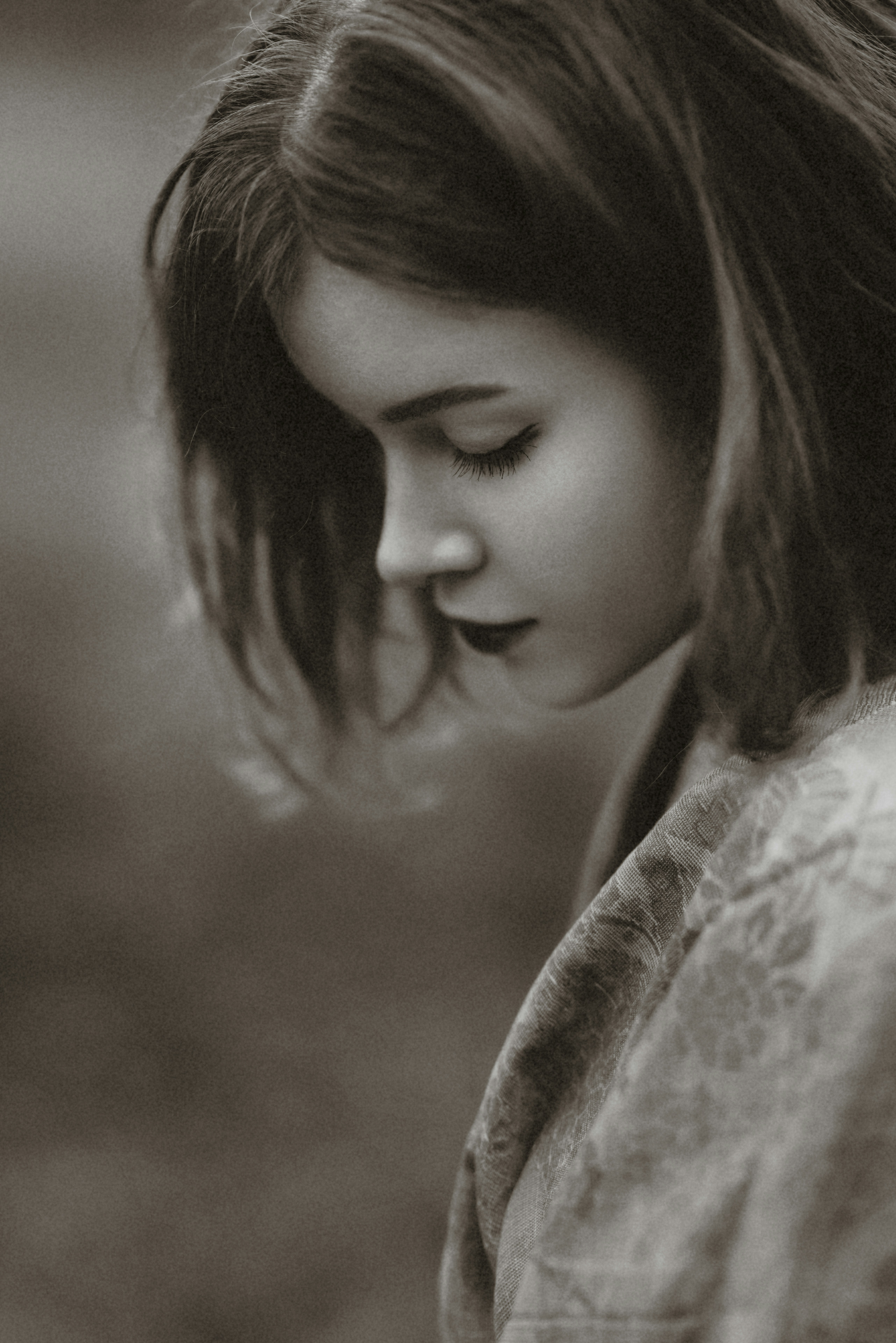 Soft Reverie: A Gentle Portrait in Sepia