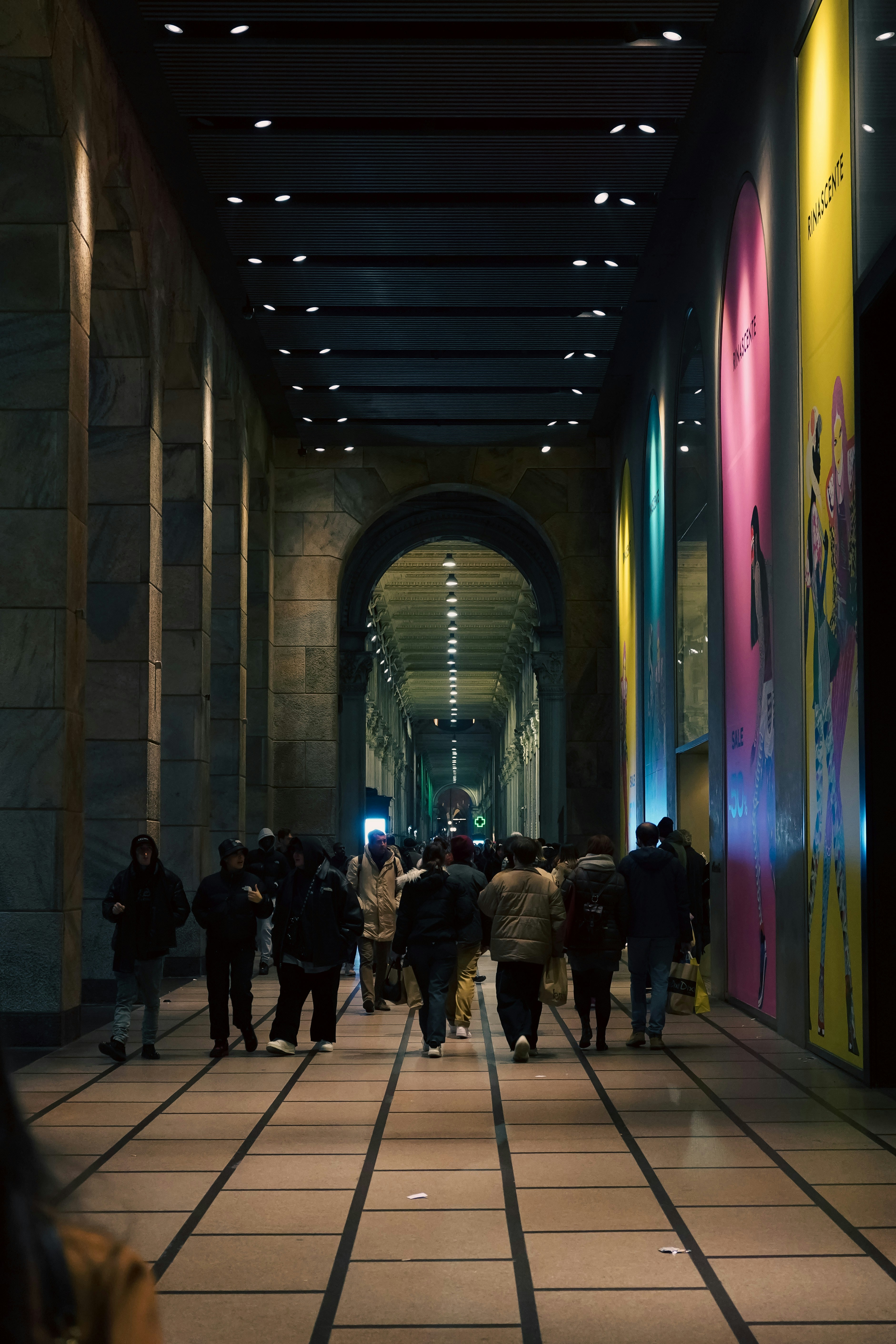 A group of people walking down a long hallway photo – Free Image on ...