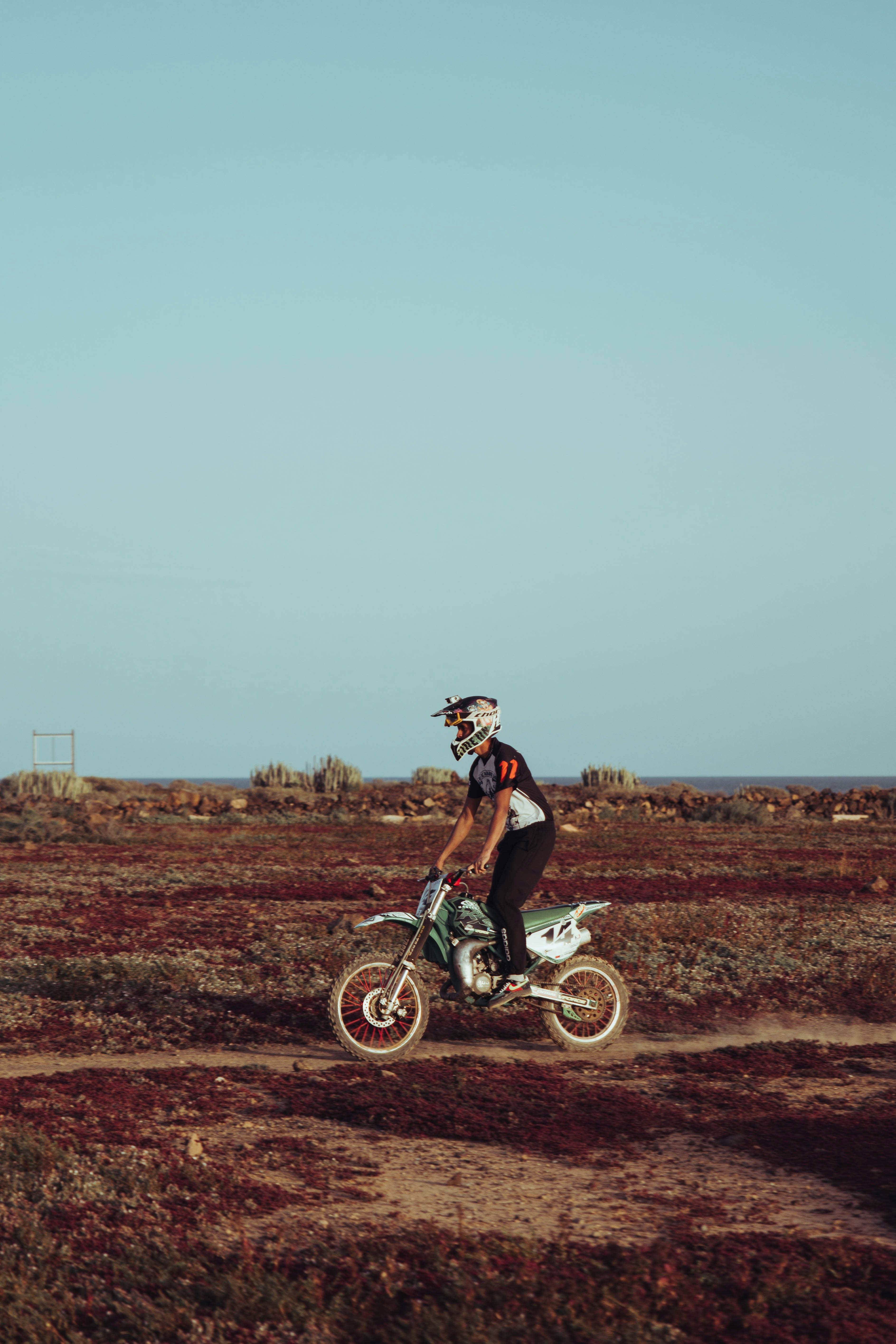 Rider on a Dusty Horizon: Motocross in an Open Desert
