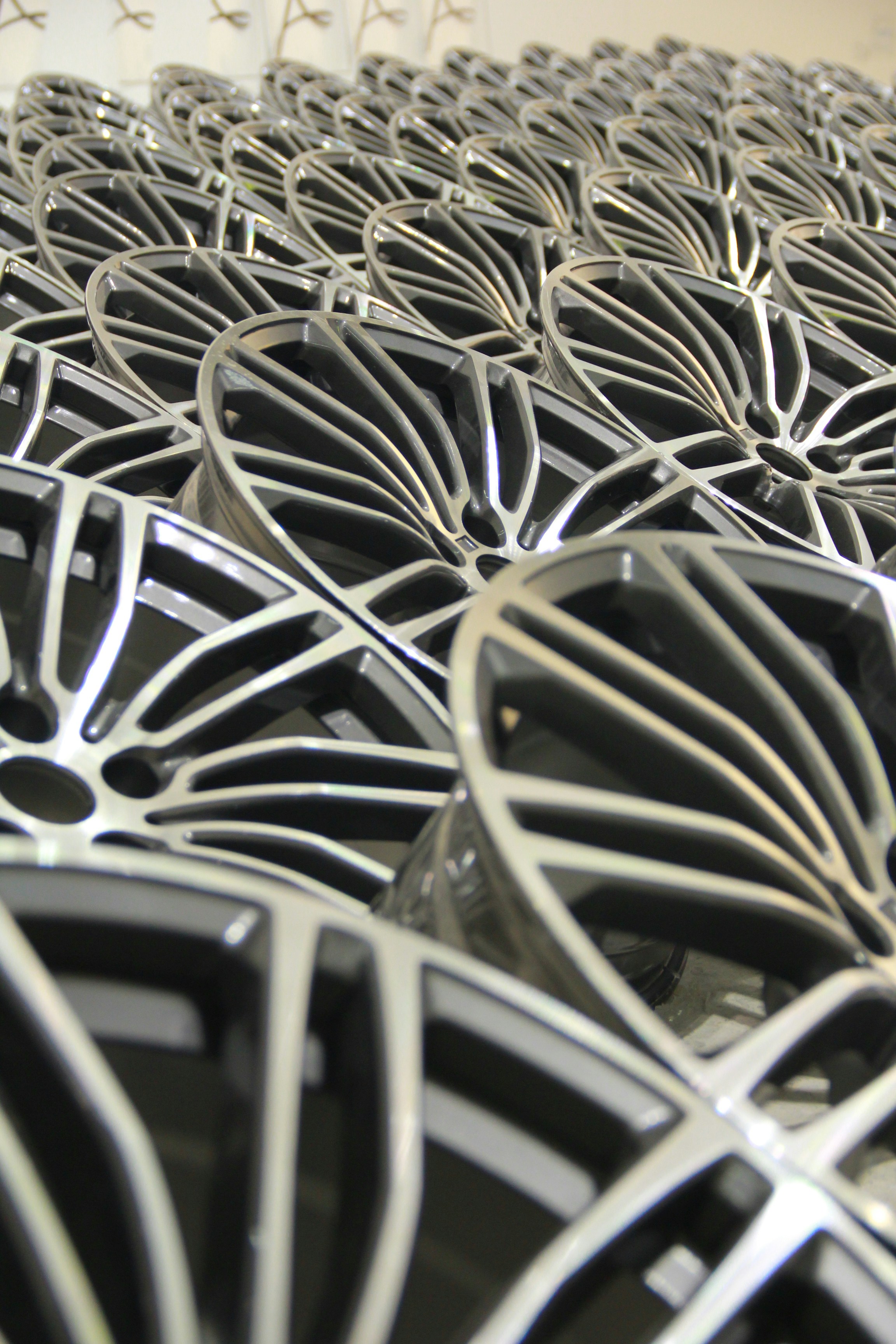 A close up of a bunch of black and silver wheels photo – Free Steel ...