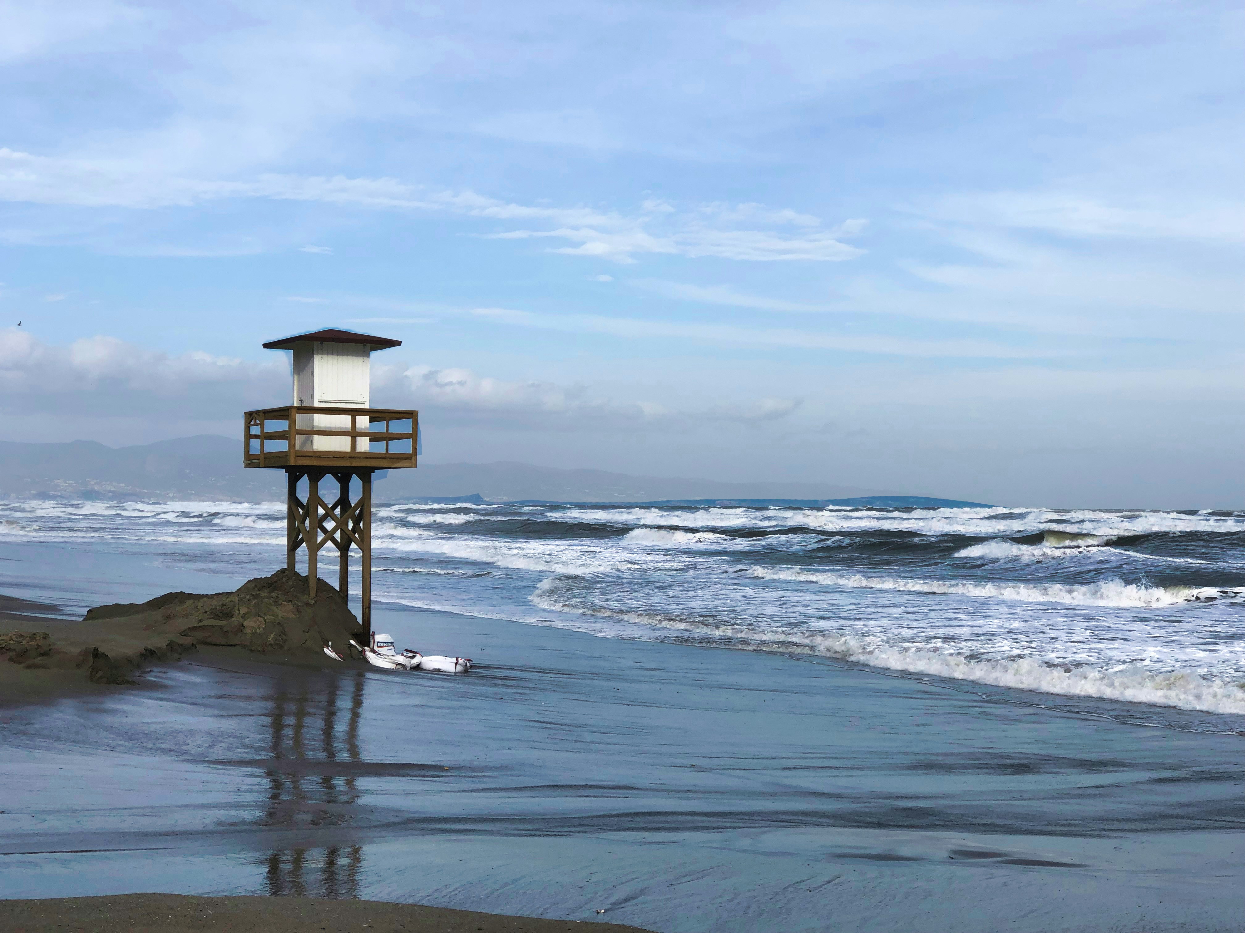 A life guard tower on a stormy beach