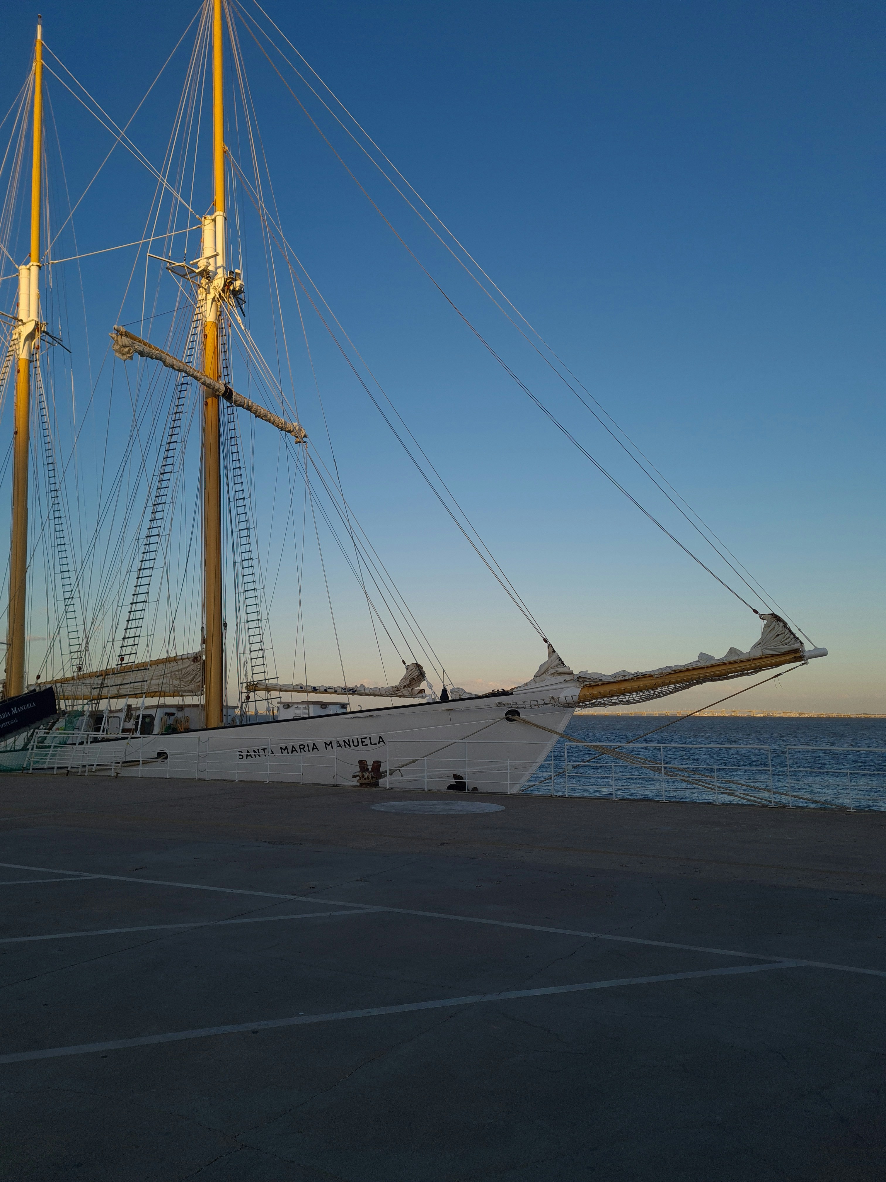 Masts at Dusk: A Sailship Resting at the Quay