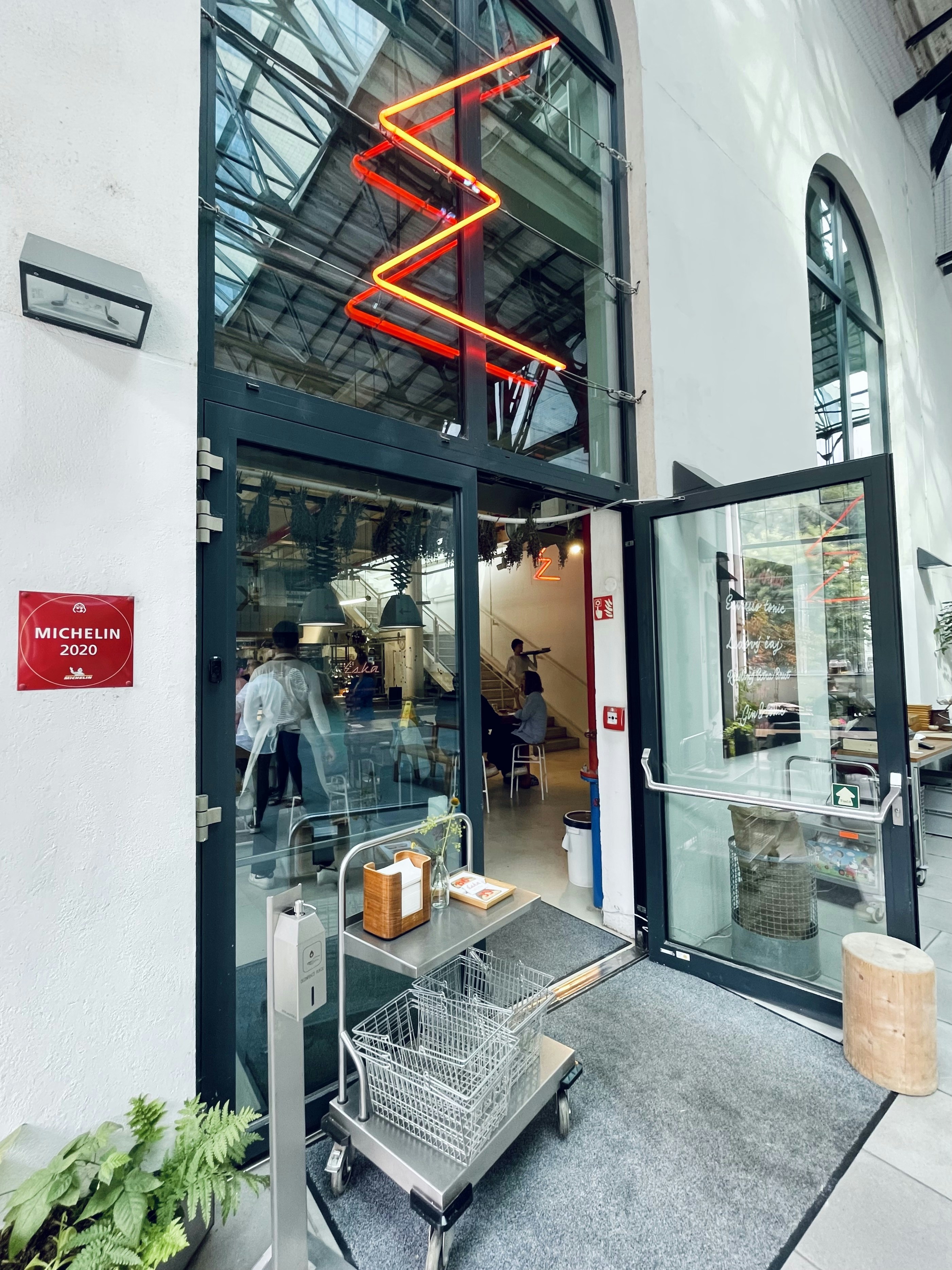  Neon Zigzag Entrance: A Café Threshold into Light and Activity