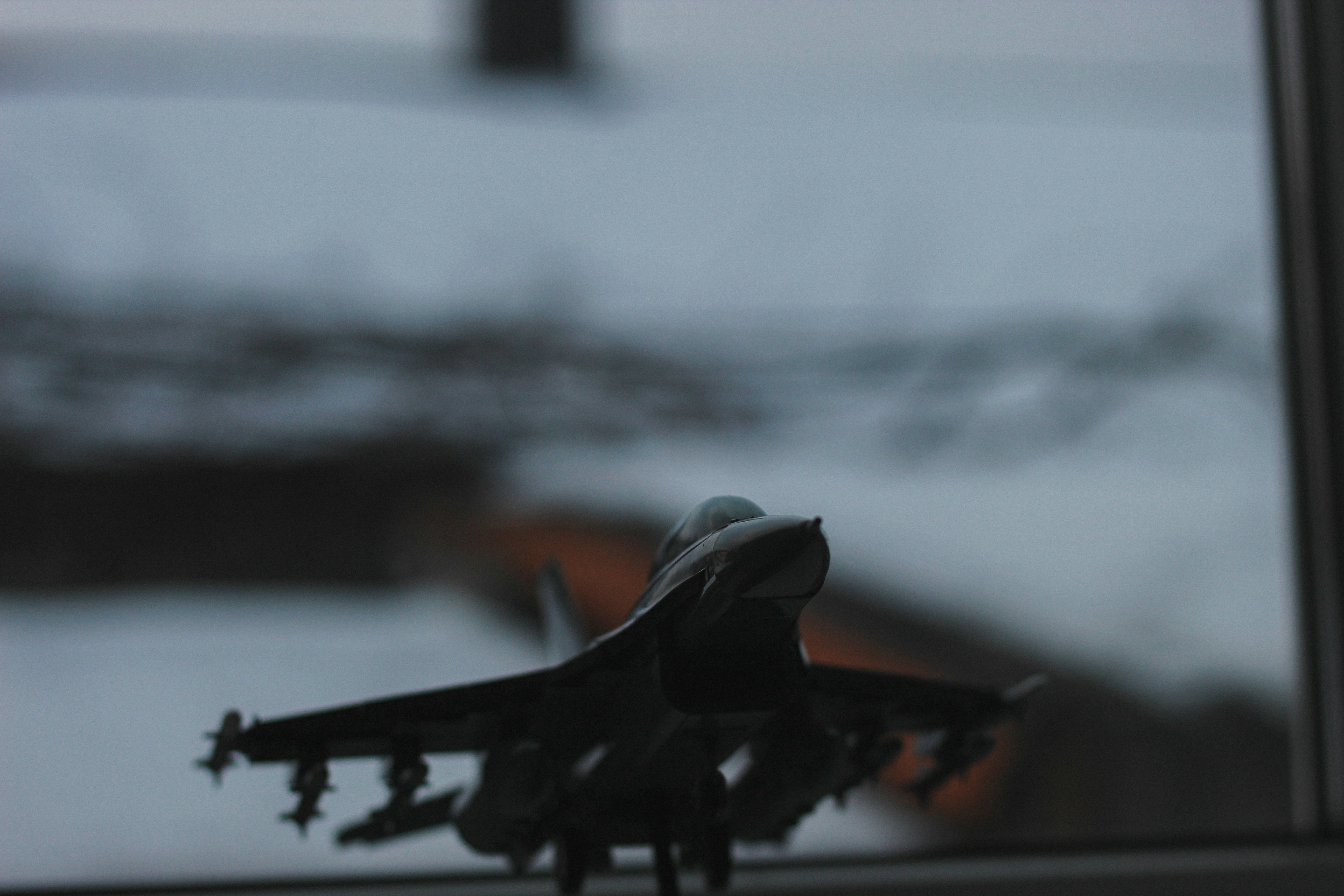 A toy airplane sitting on top of a window sill photo – Free Ukraine ...