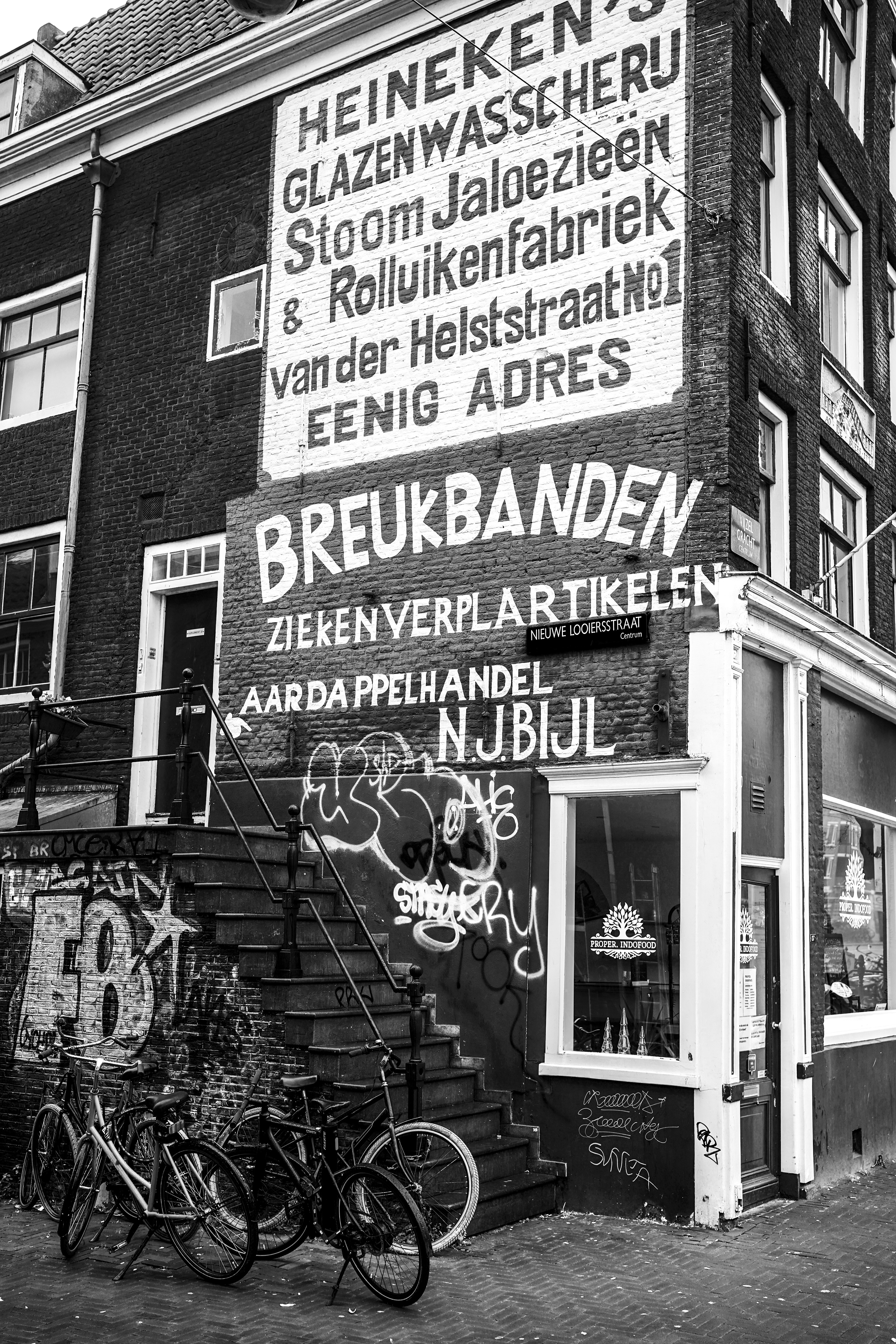 Typography on the Brick: Graffiti, Stairs, and Bicycles in Monochrome