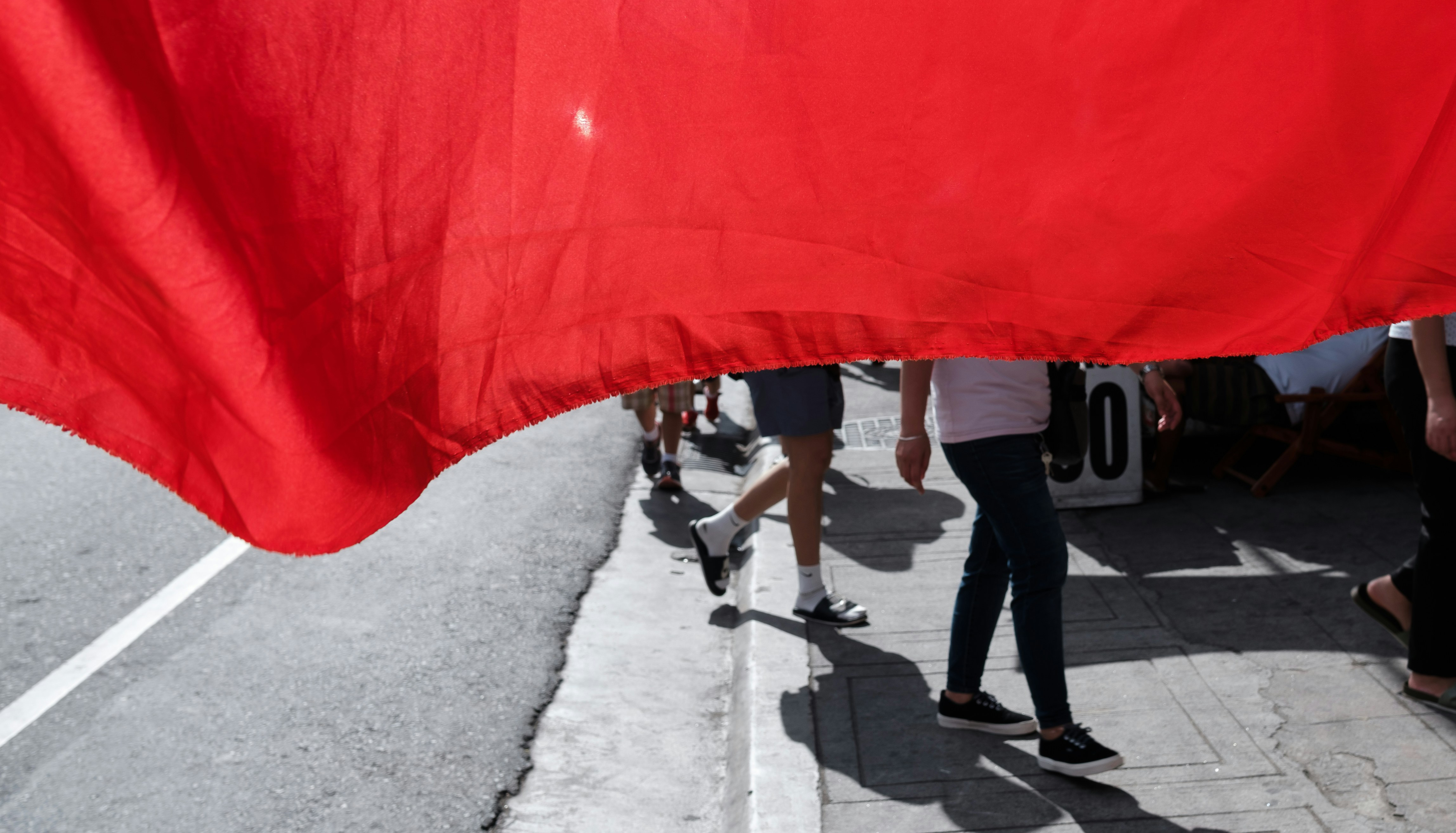 A large red flag on the side of a road photo – Free People Image on ...