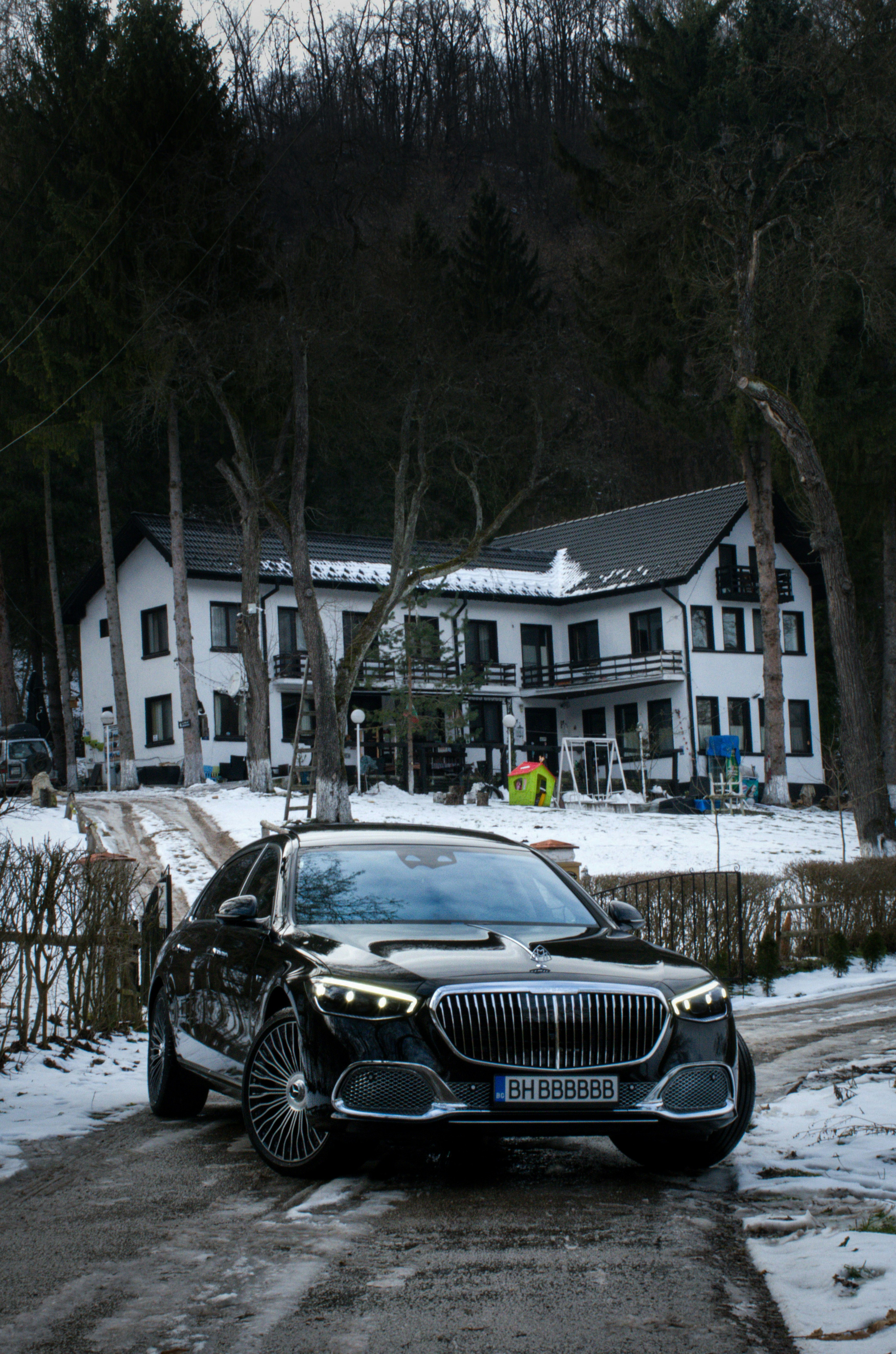 a car parked on the side of a snow covered road