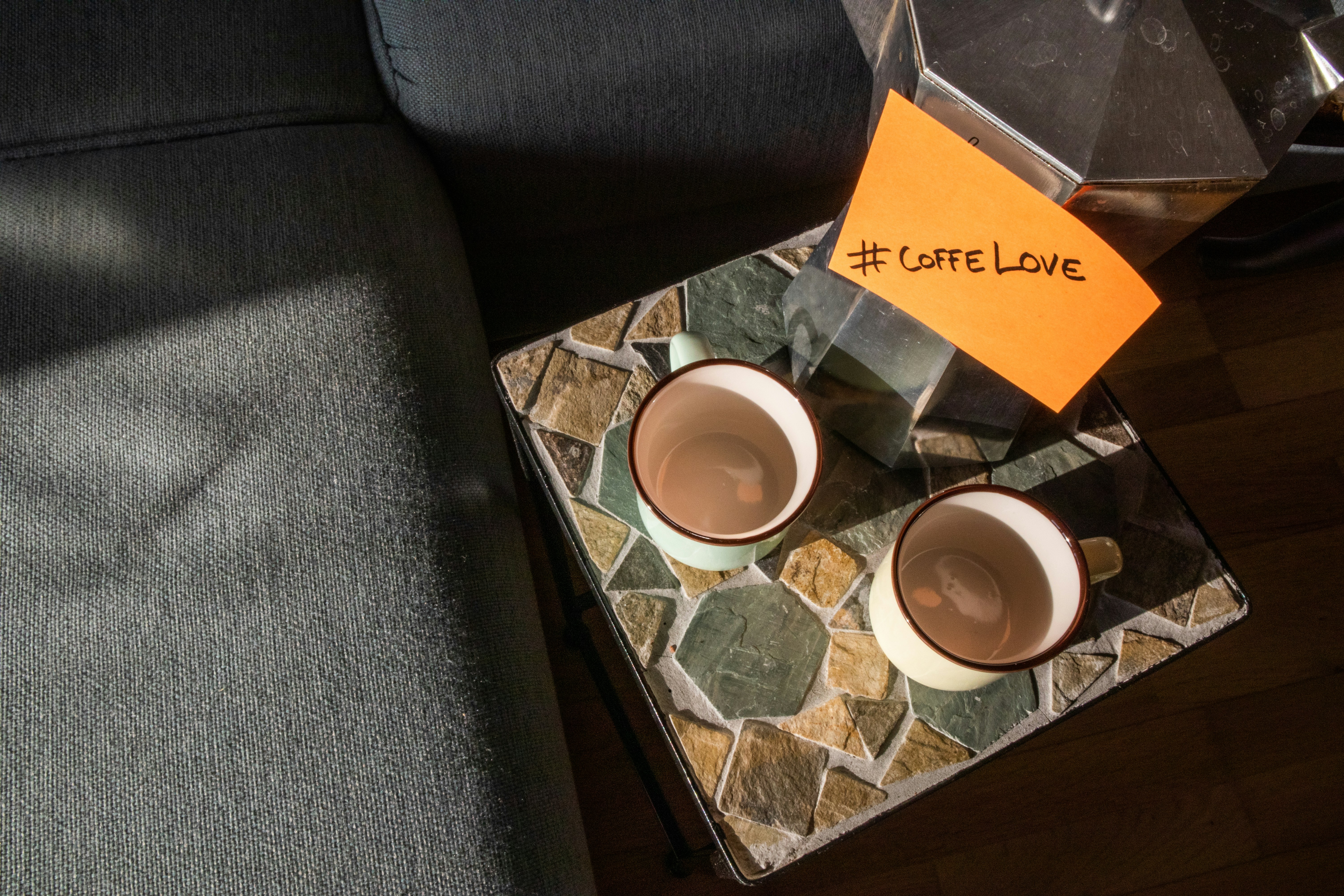 Sunlit Mugs on a Mosaic Table: Quiet Morning Glow